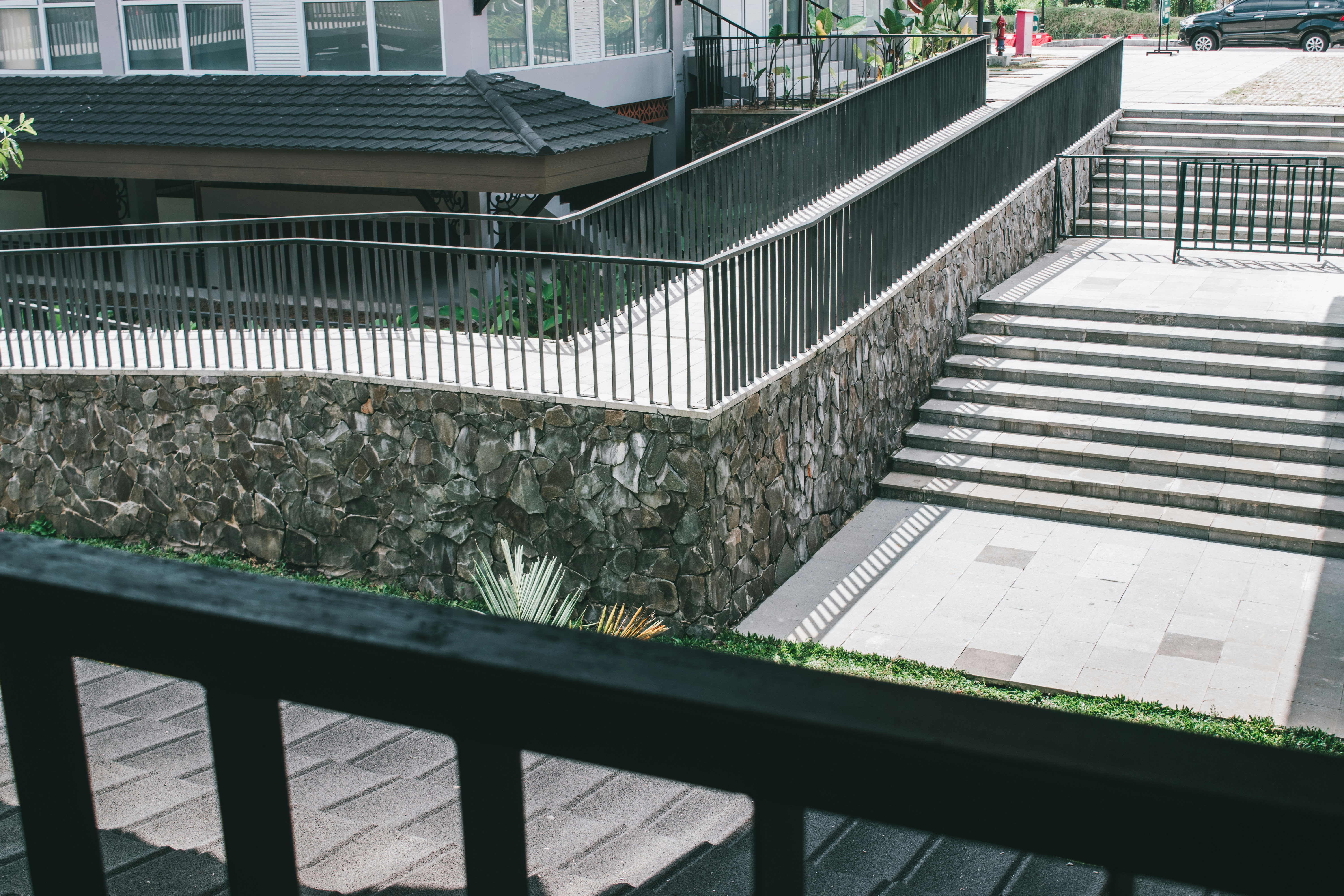 A ramp and stairs lead to a building entrance. photo – Free Car Image ...