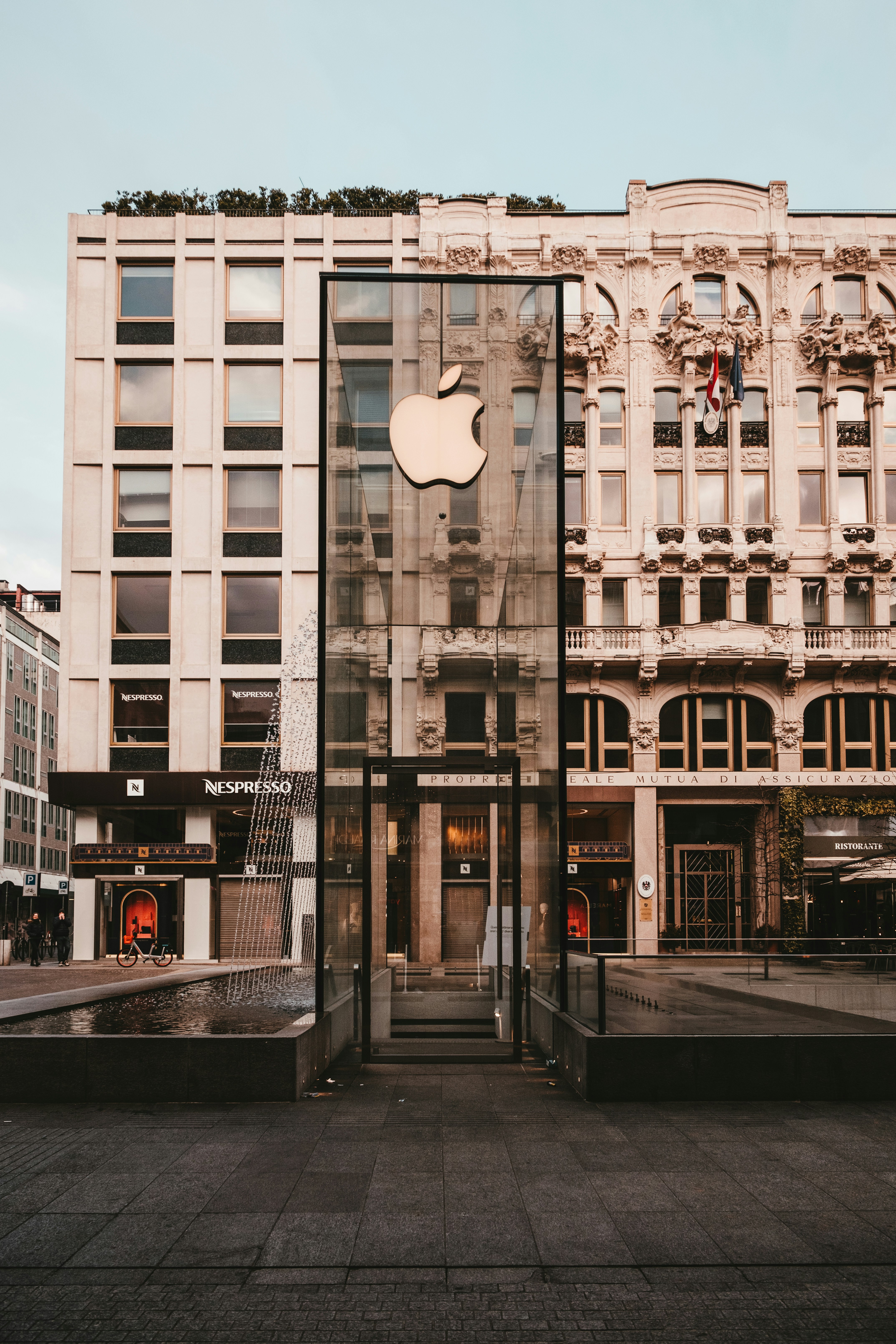 An apple store with a glass facade.