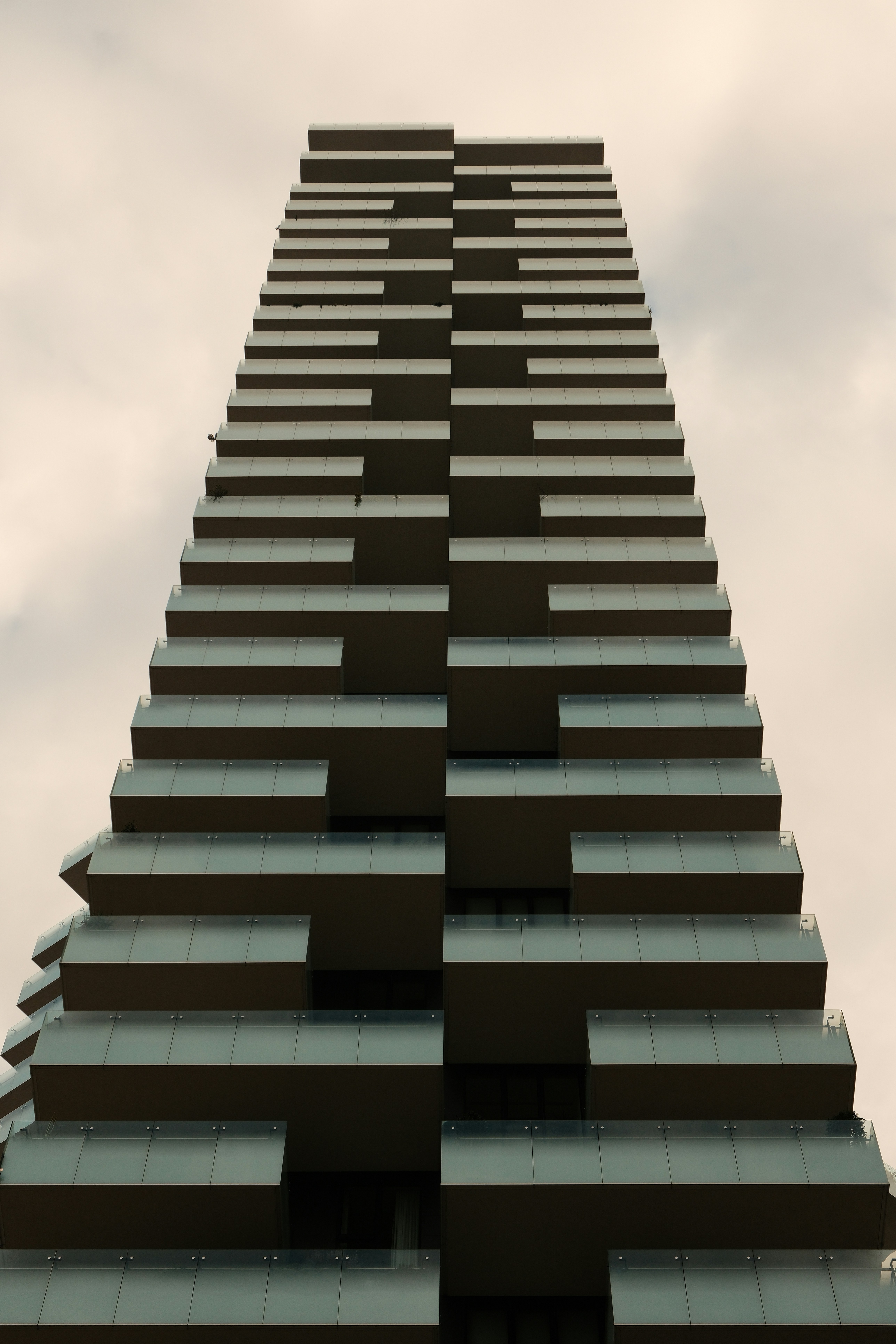 A modern skyscraper stretches high into the sky.