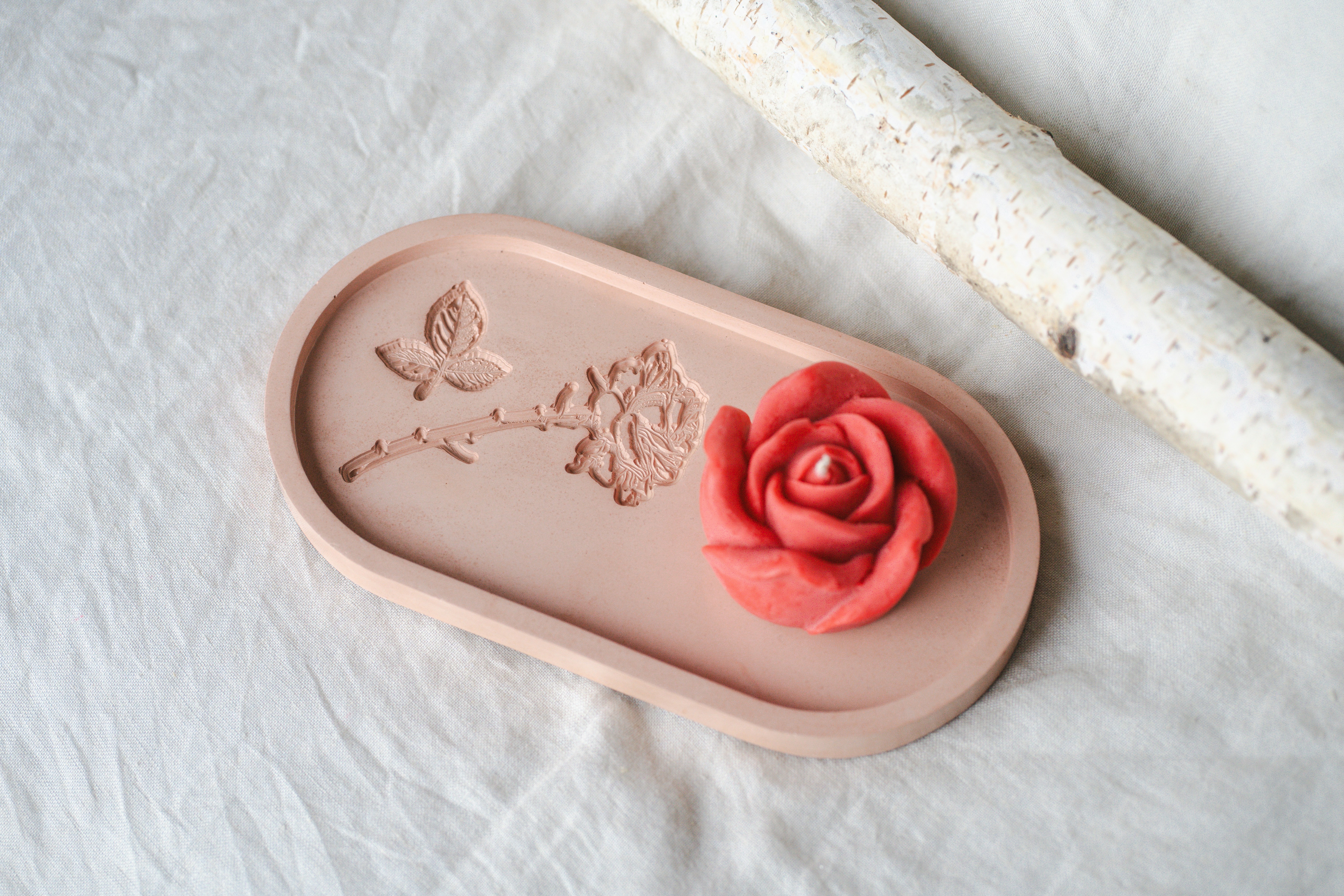 Rose in Relief: Carved Bloom on a Peach Soap Dish