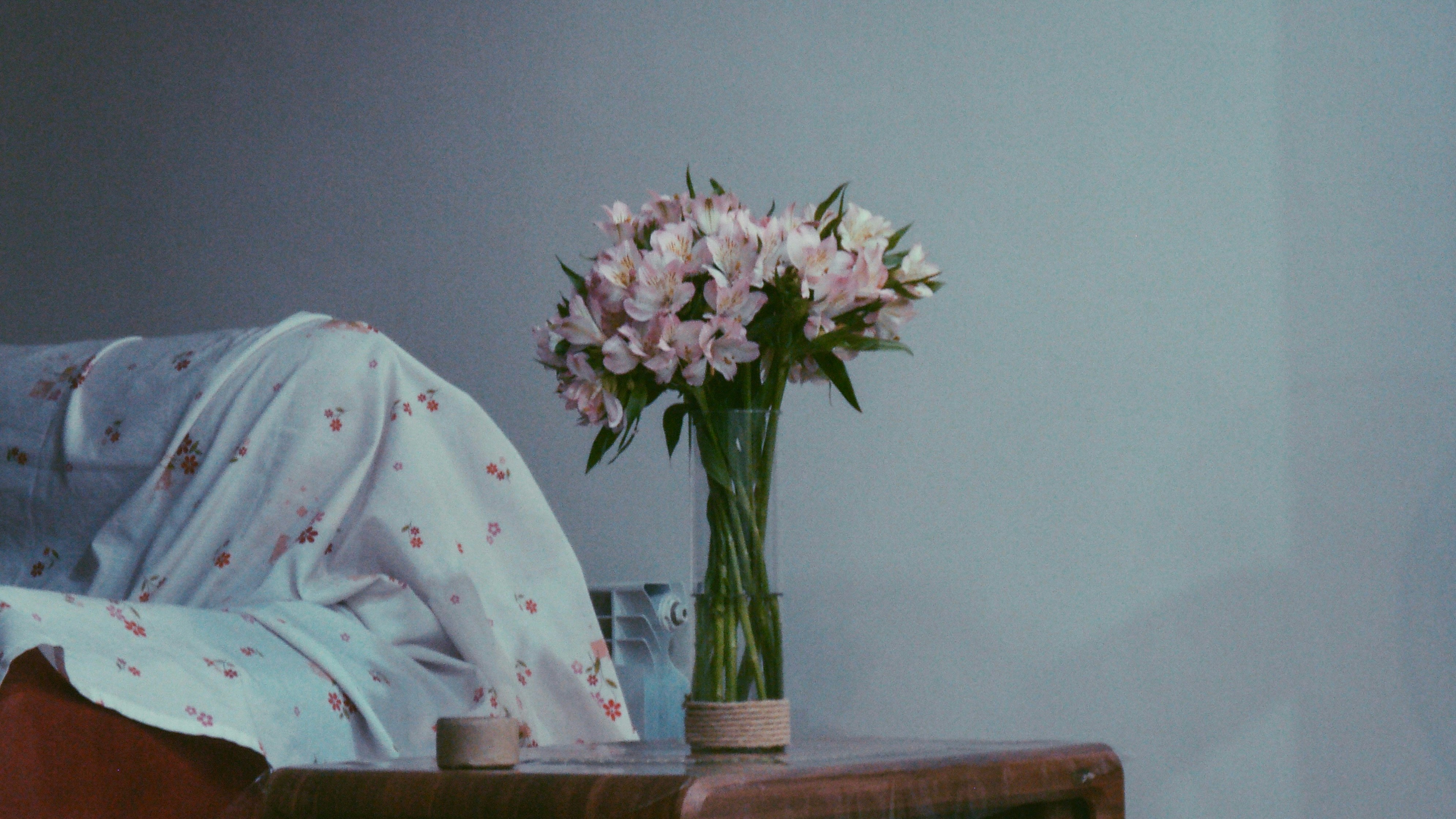 Bouquet on the Nightstand: Quiet Bedroom with Floral Accent