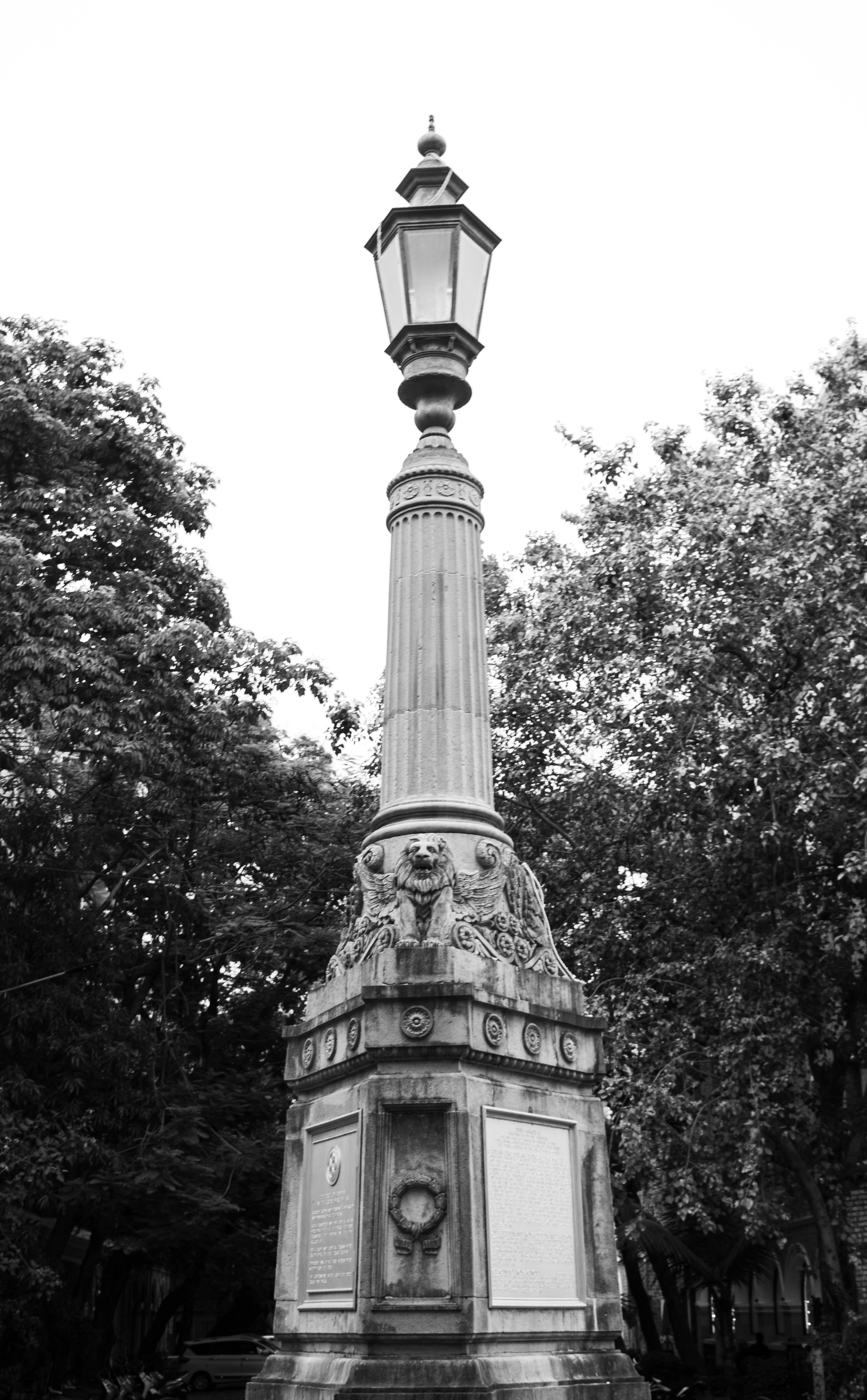 An ornate lamp post stands tall in a park. photo – Free Architecture ...