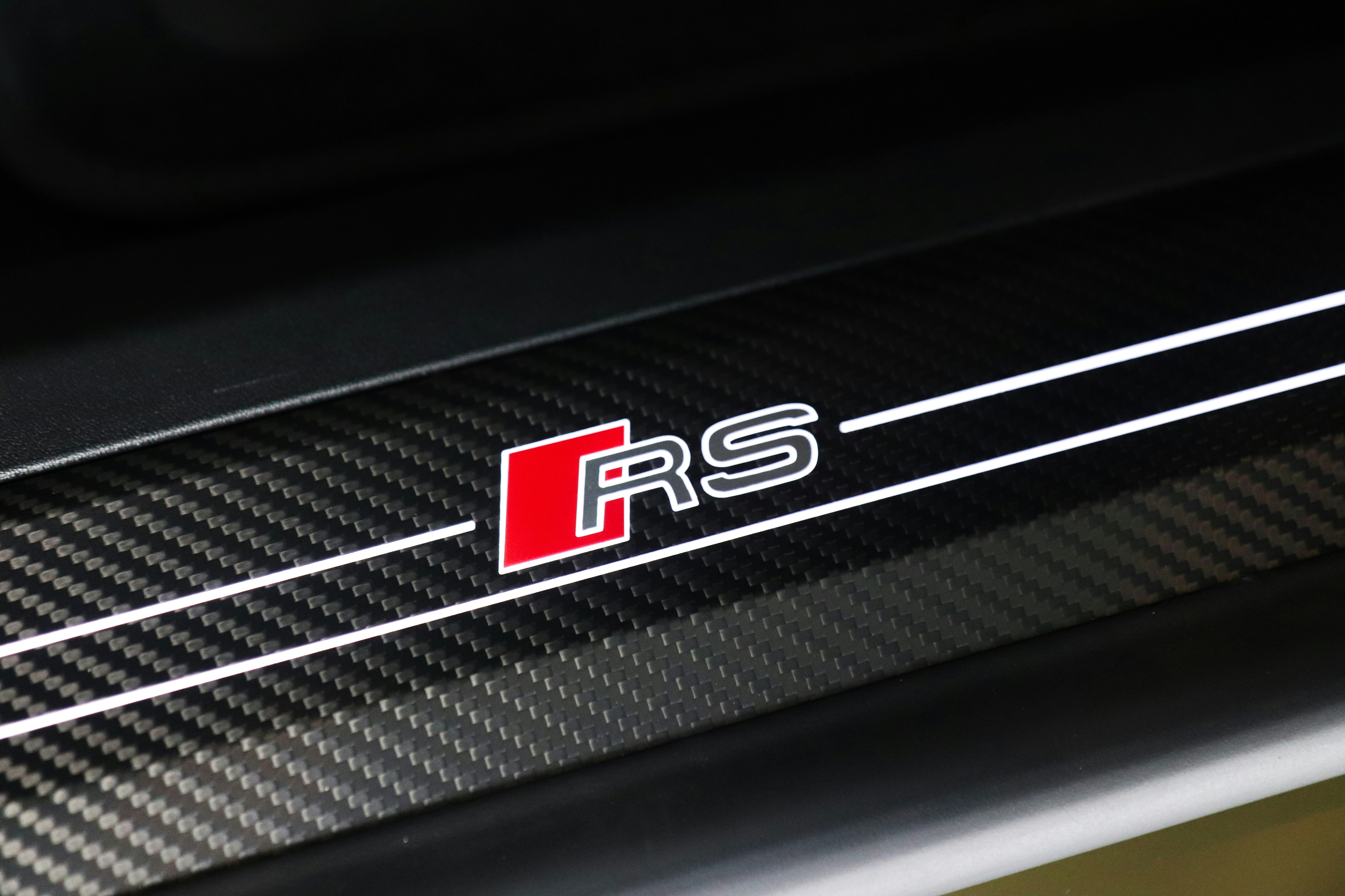 The audi rs logo is displayed on a black panel. photo – Free Sport ...