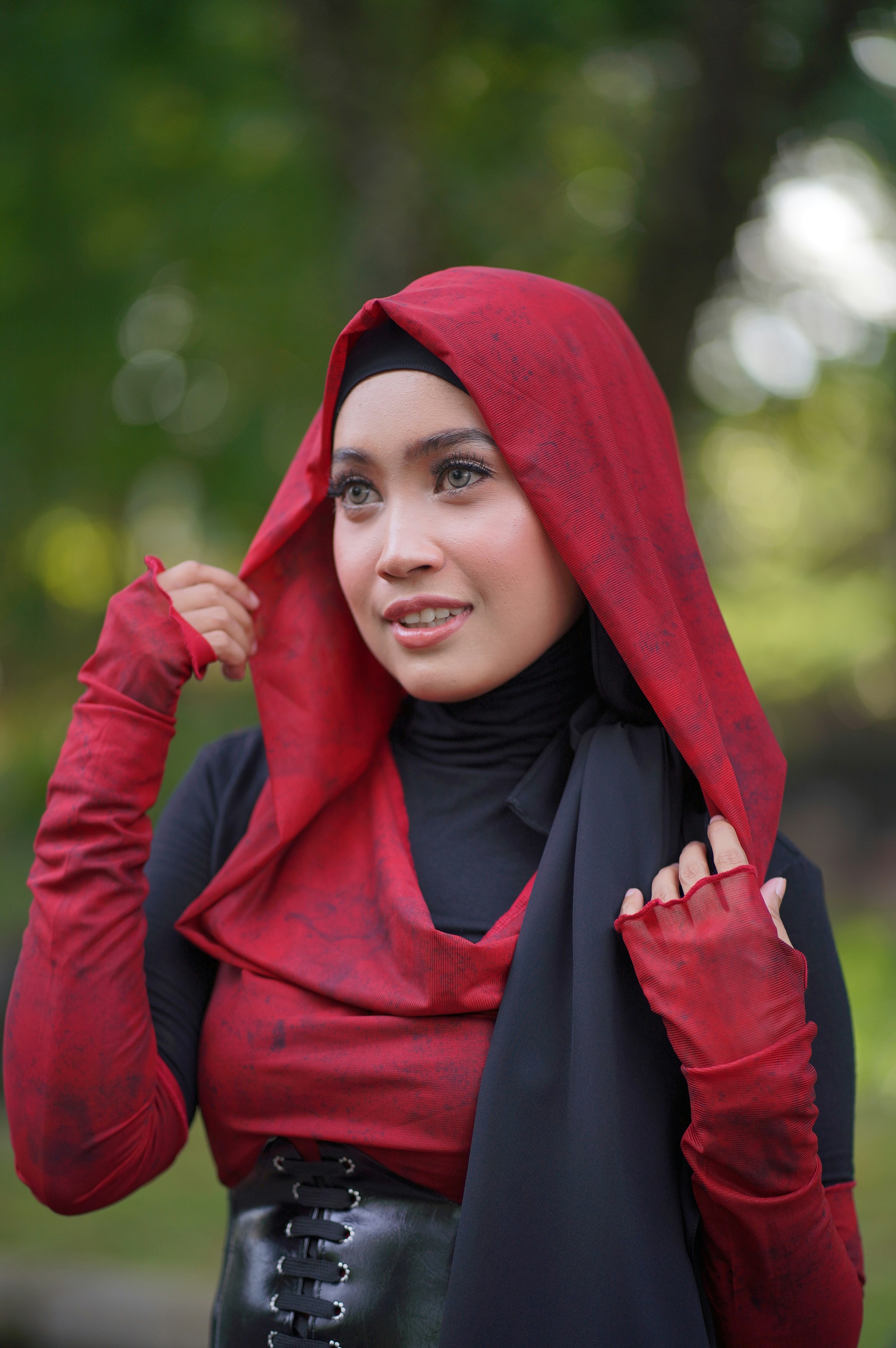 Crimson Veil Portrait: Quiet Confidence in a Sunlit Grove
