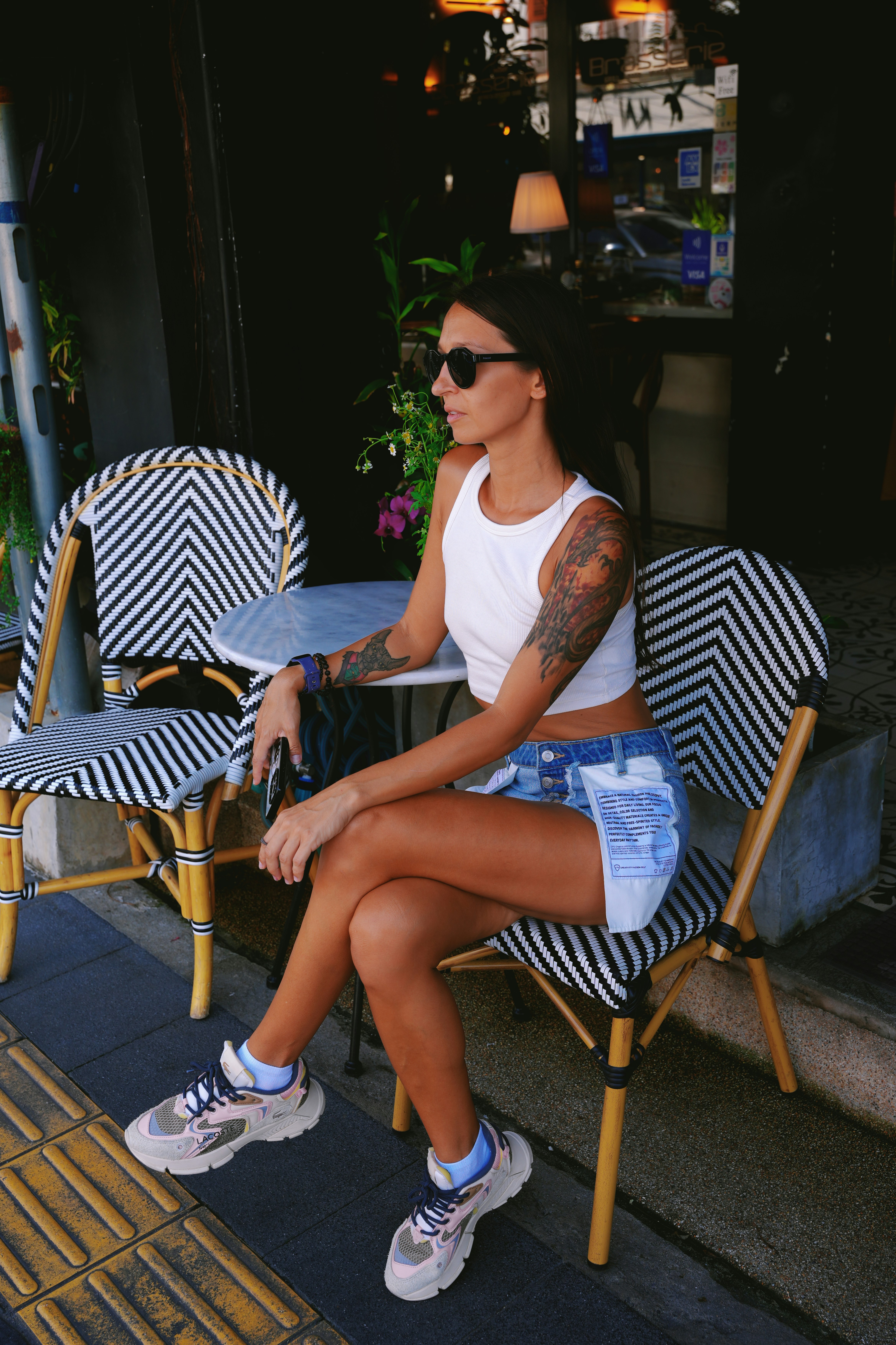 City Café Calm: Sunglasses and Stripes Under Daylight Neon
