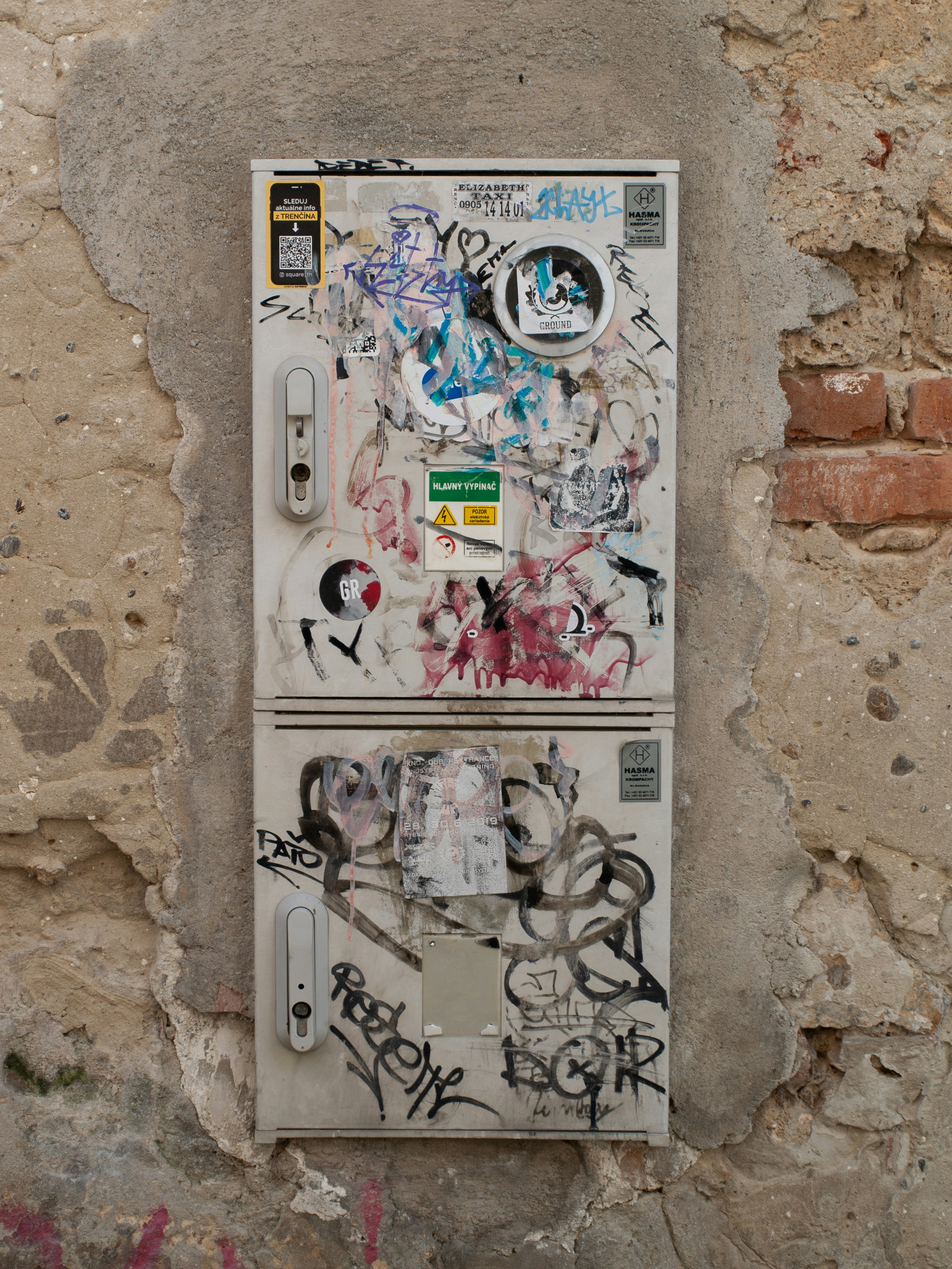 Graffiti covers an electrical box embedded in a wall. photo – Free ...