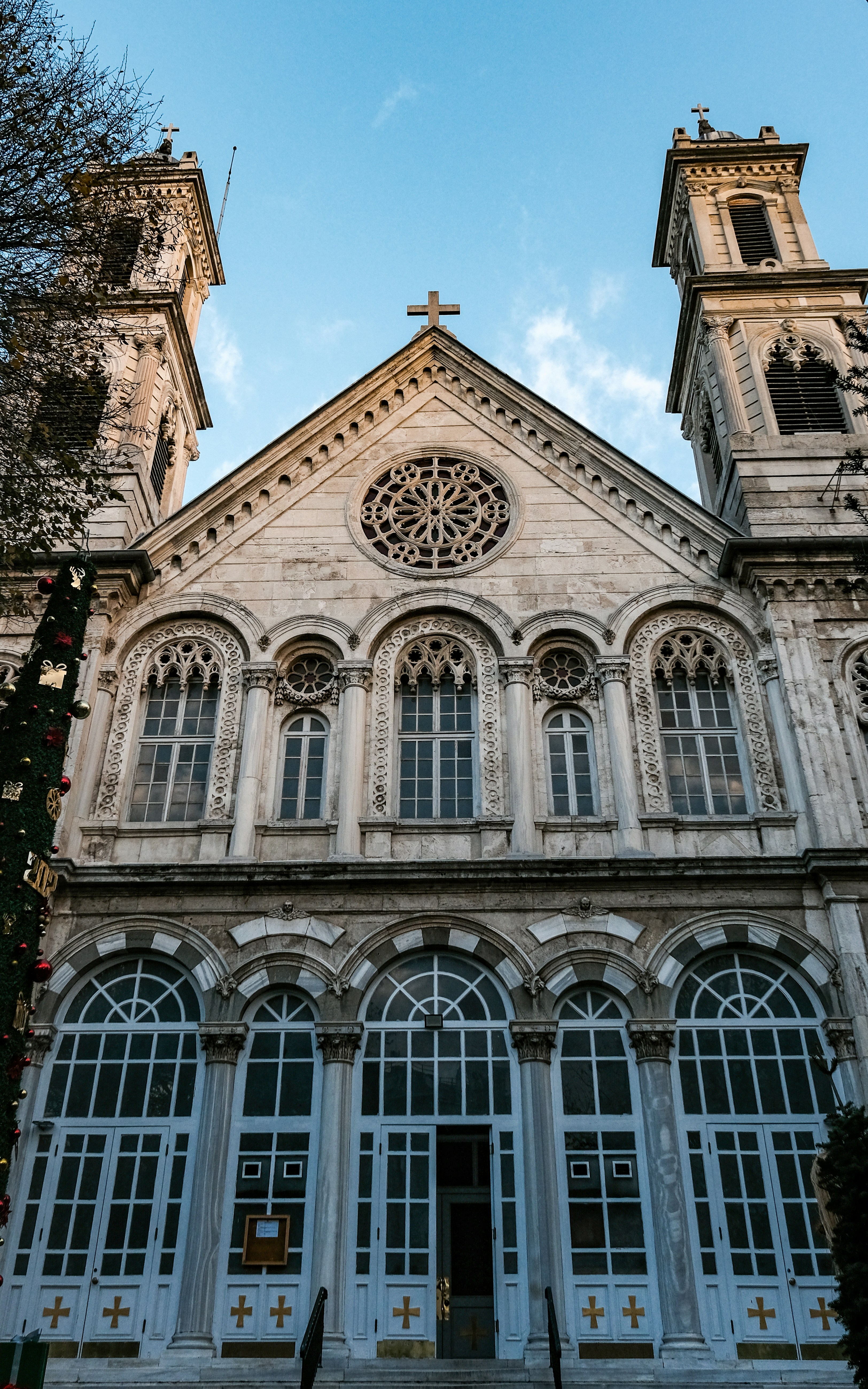 Sunlit Rose Window: Symmetry of a Church Facade Between Twin Towers