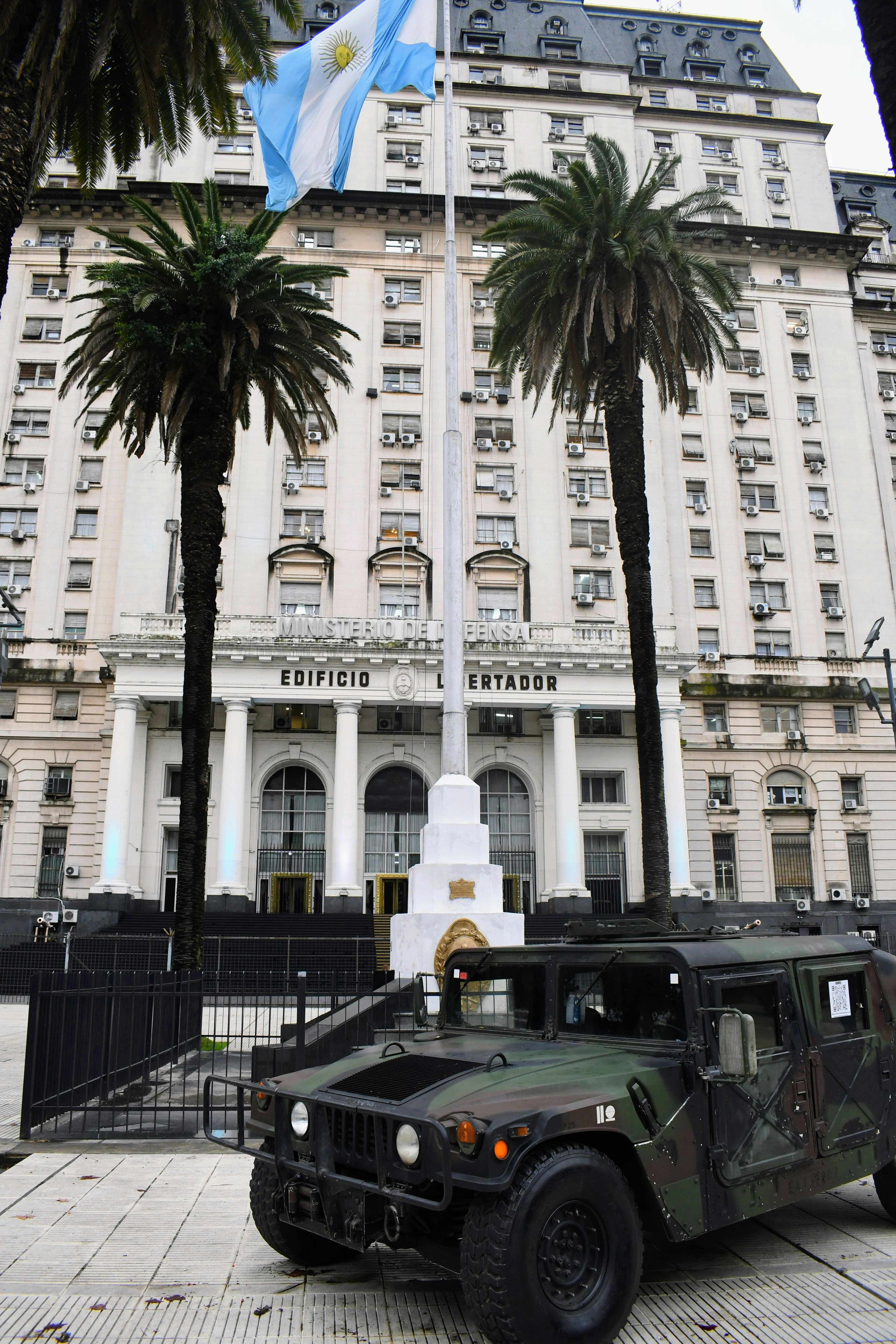 Uruguay to Argentina: Flag, Monument, and a Military Vehicle Guarding the City Hall