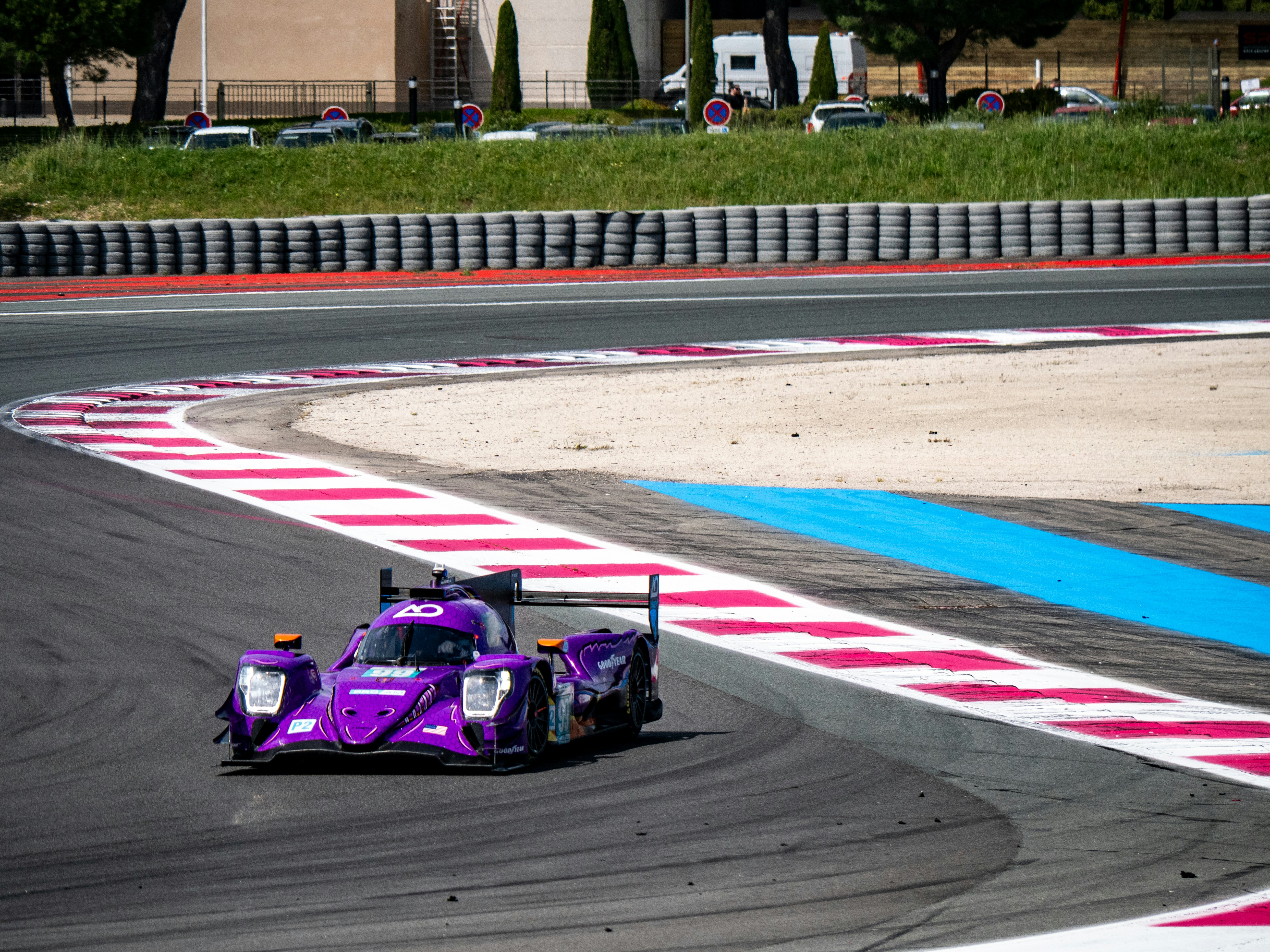 Purple Prototype Slices the Curve on a Racing Circuit