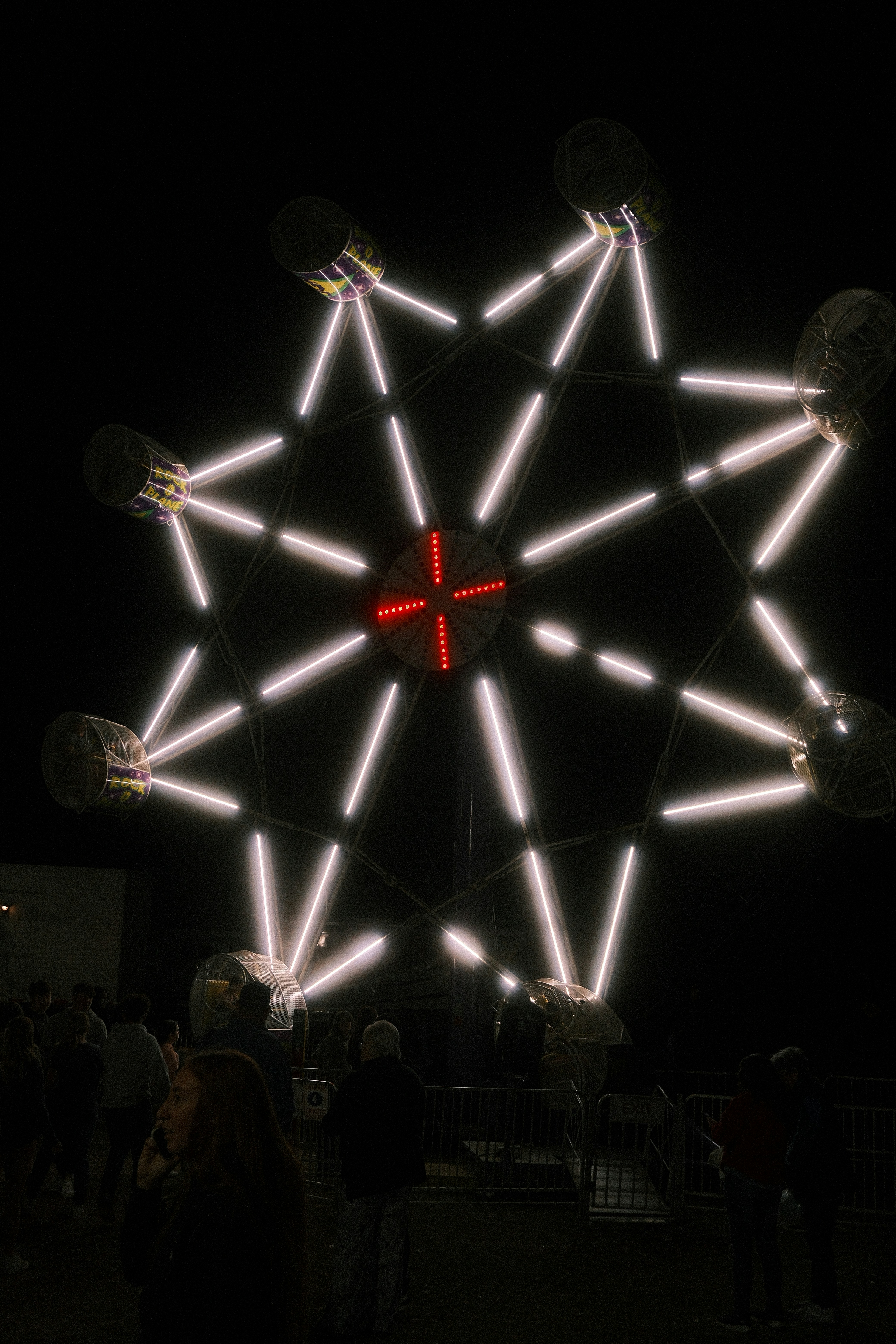 A neon light carnival ride is shining brightly. photo – Free Star Image ...