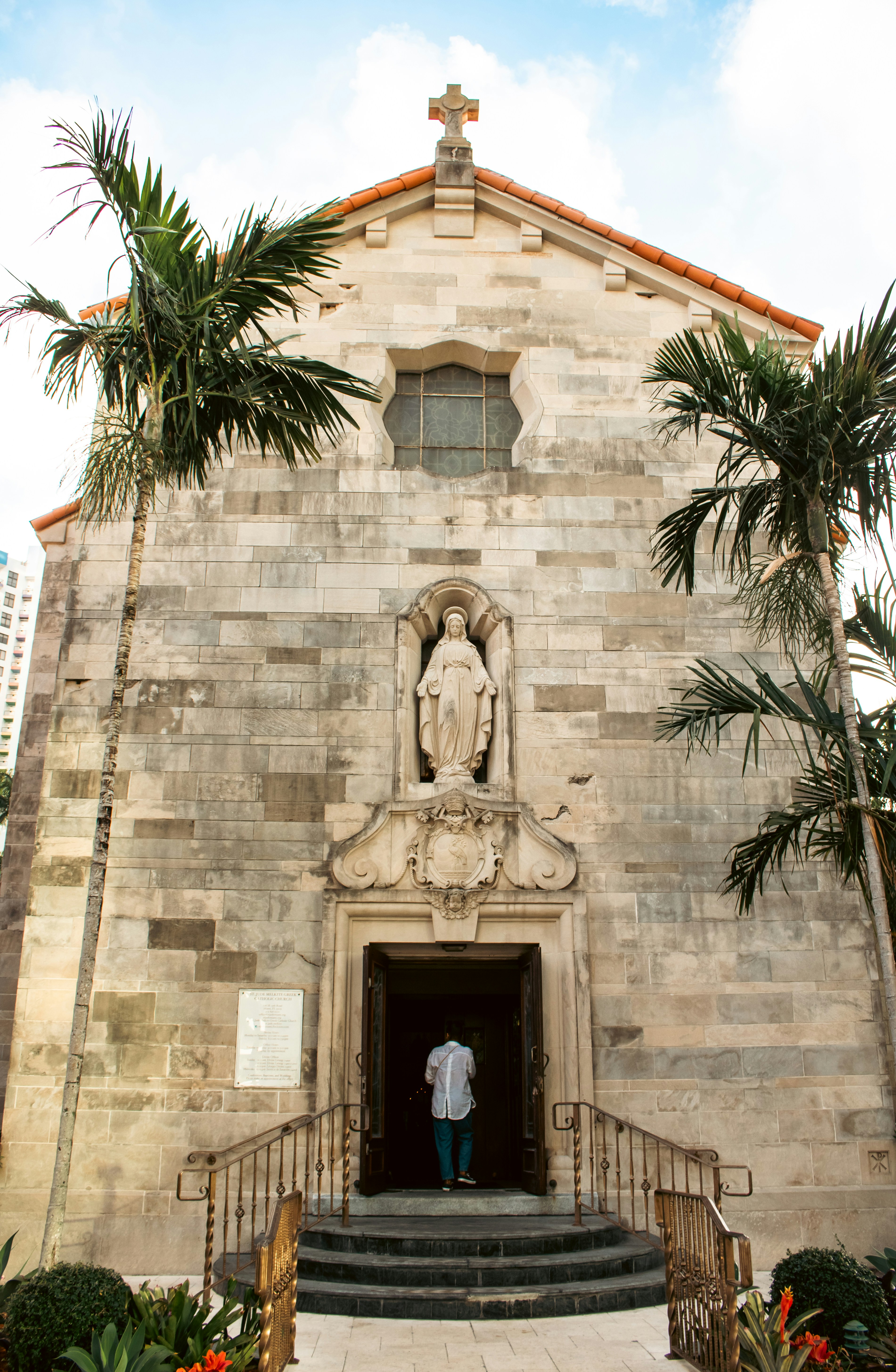 Stone Chapel with a Seated Protector Framed by Palm Arches