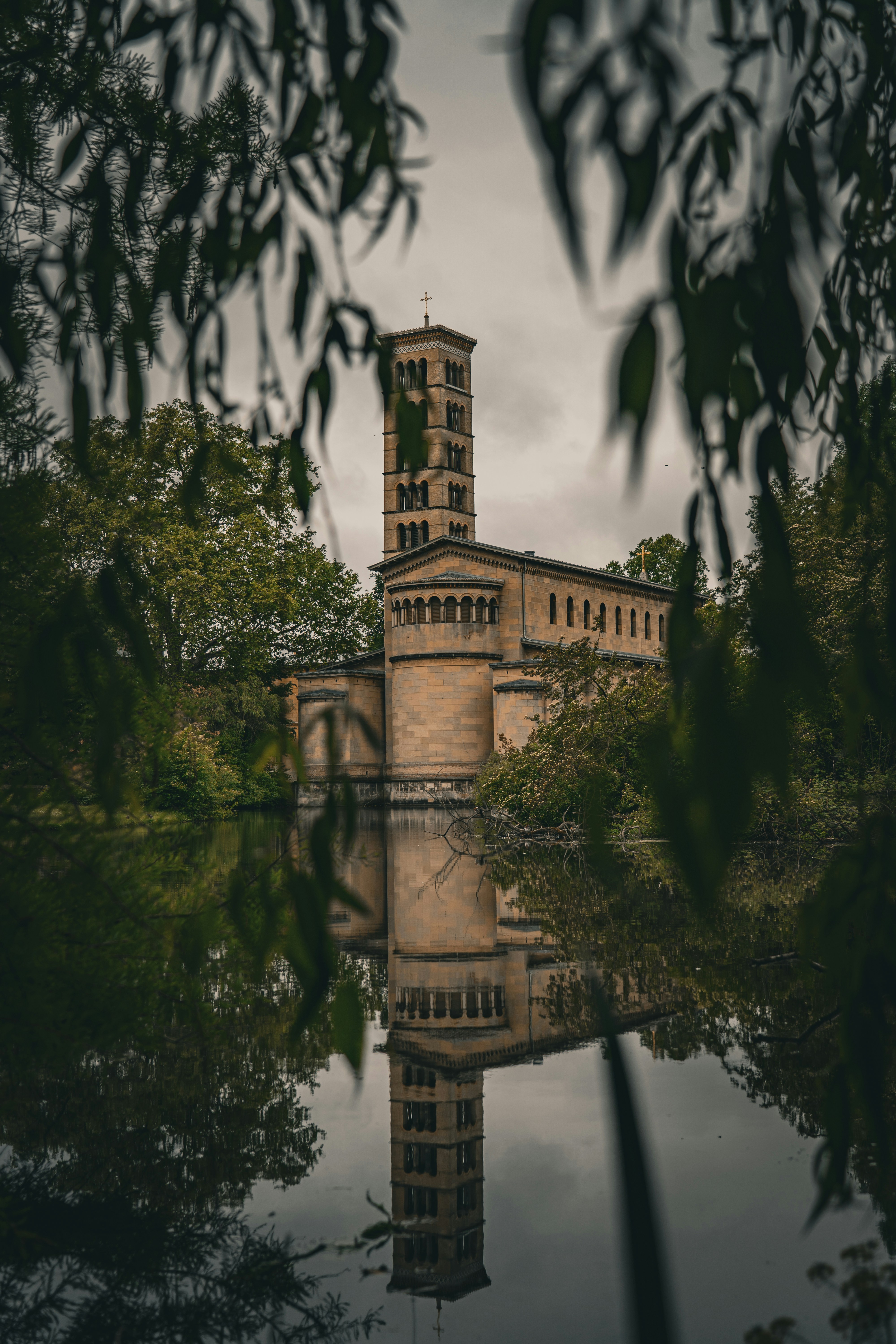 Reflected Bell Tower: Stillness Framing a Riverside Church