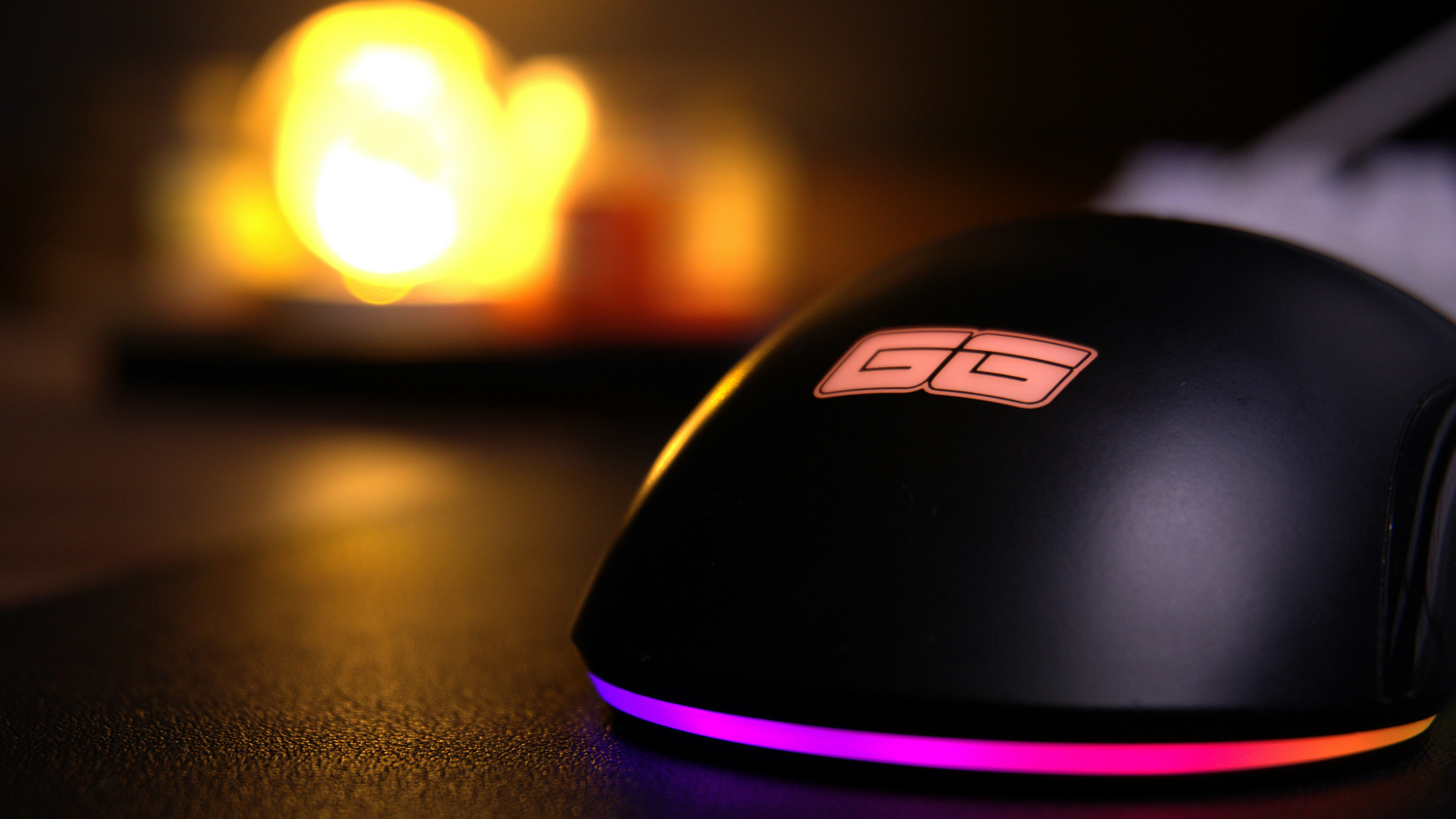 A gaming mouse with glowing lights is in focus. photo – Free Mouse ...