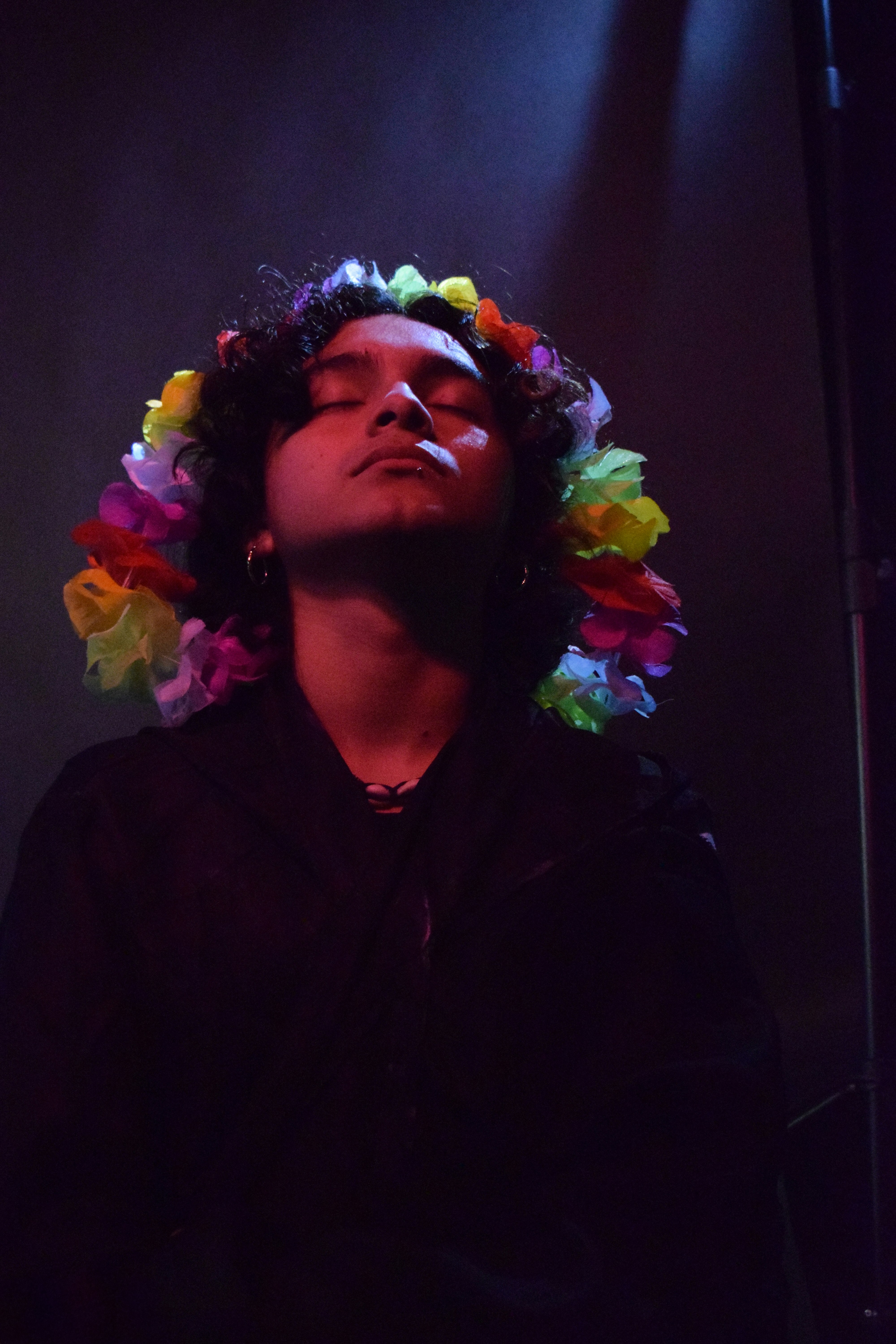 Person wears flower garland in dim lighting. photo – Free Rgb Image on ...