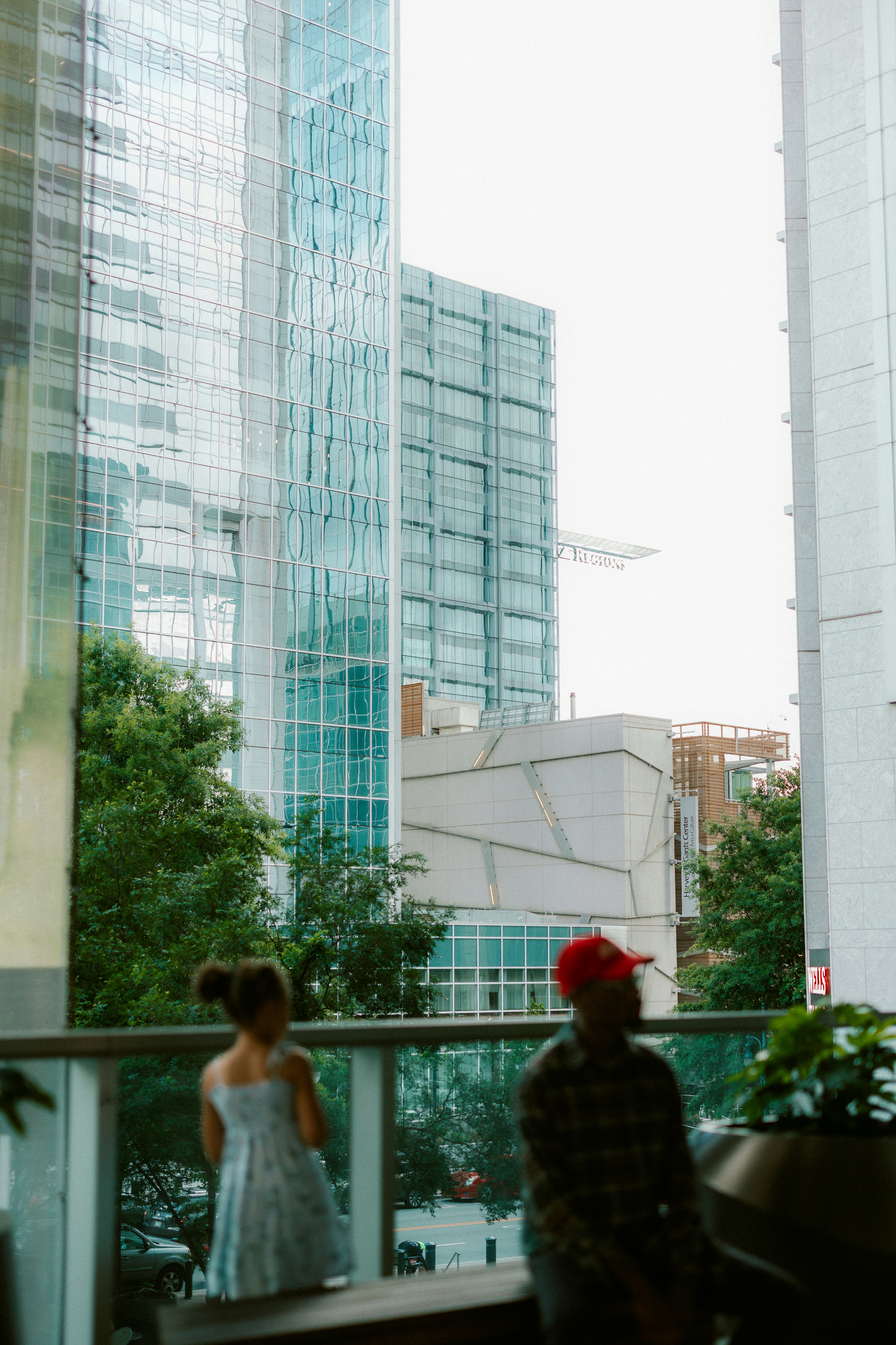 Glass Towers Beyond the Quiet Balcony
