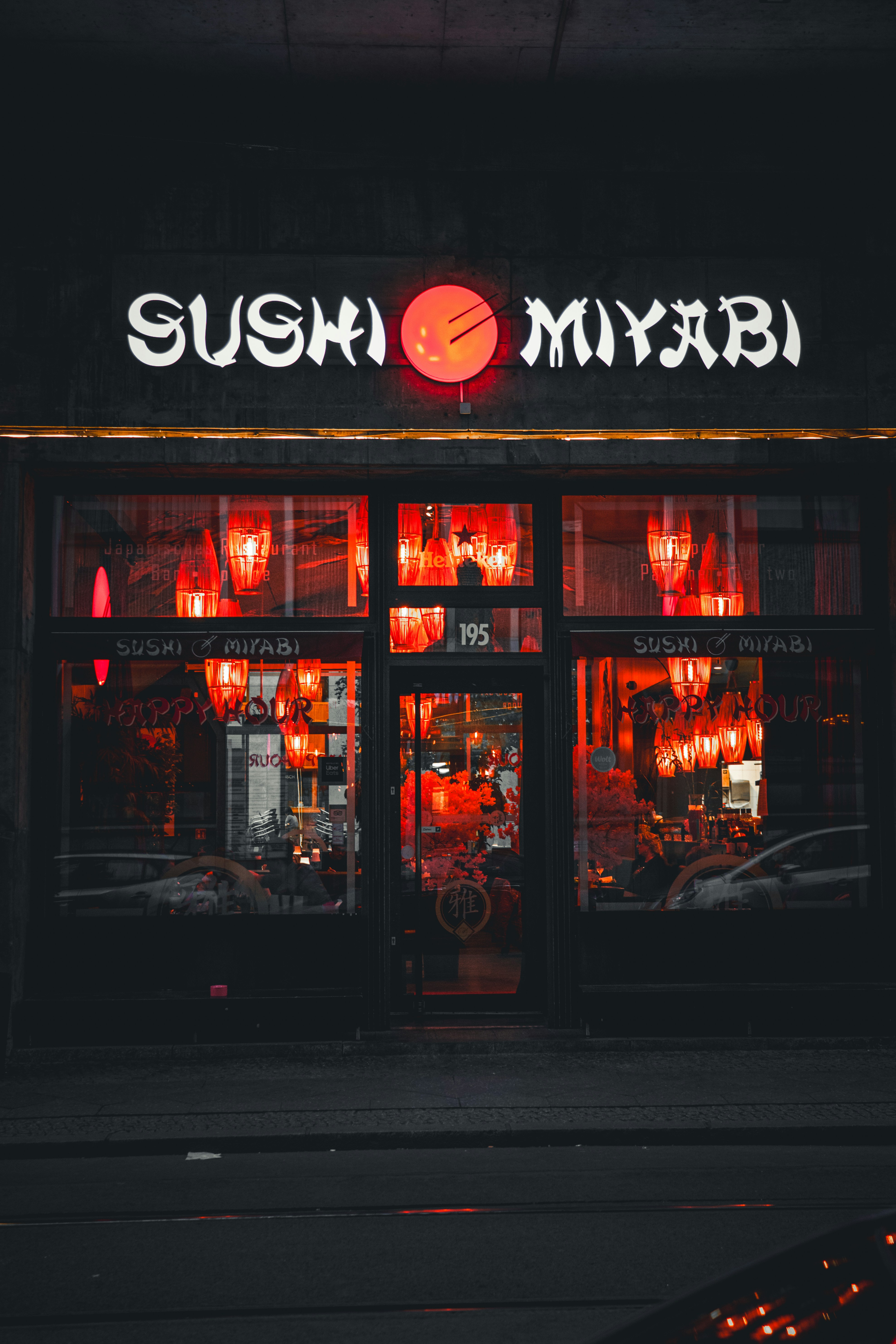 Crimson Lanterns Frame a Sushi Haven After Dark