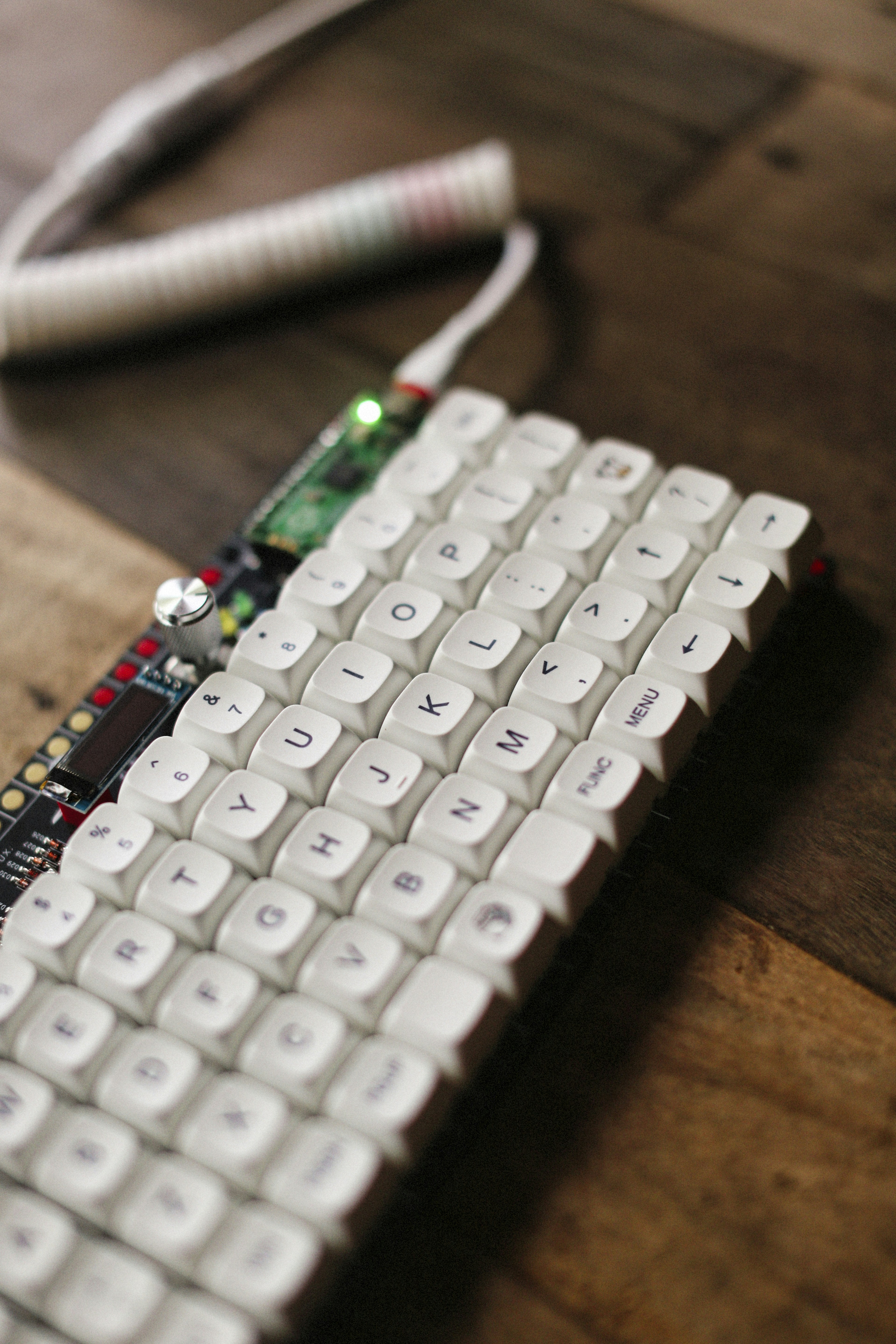 Keyed Keys: A vintage keyboard’s tactile heartbeat on a wooden stage