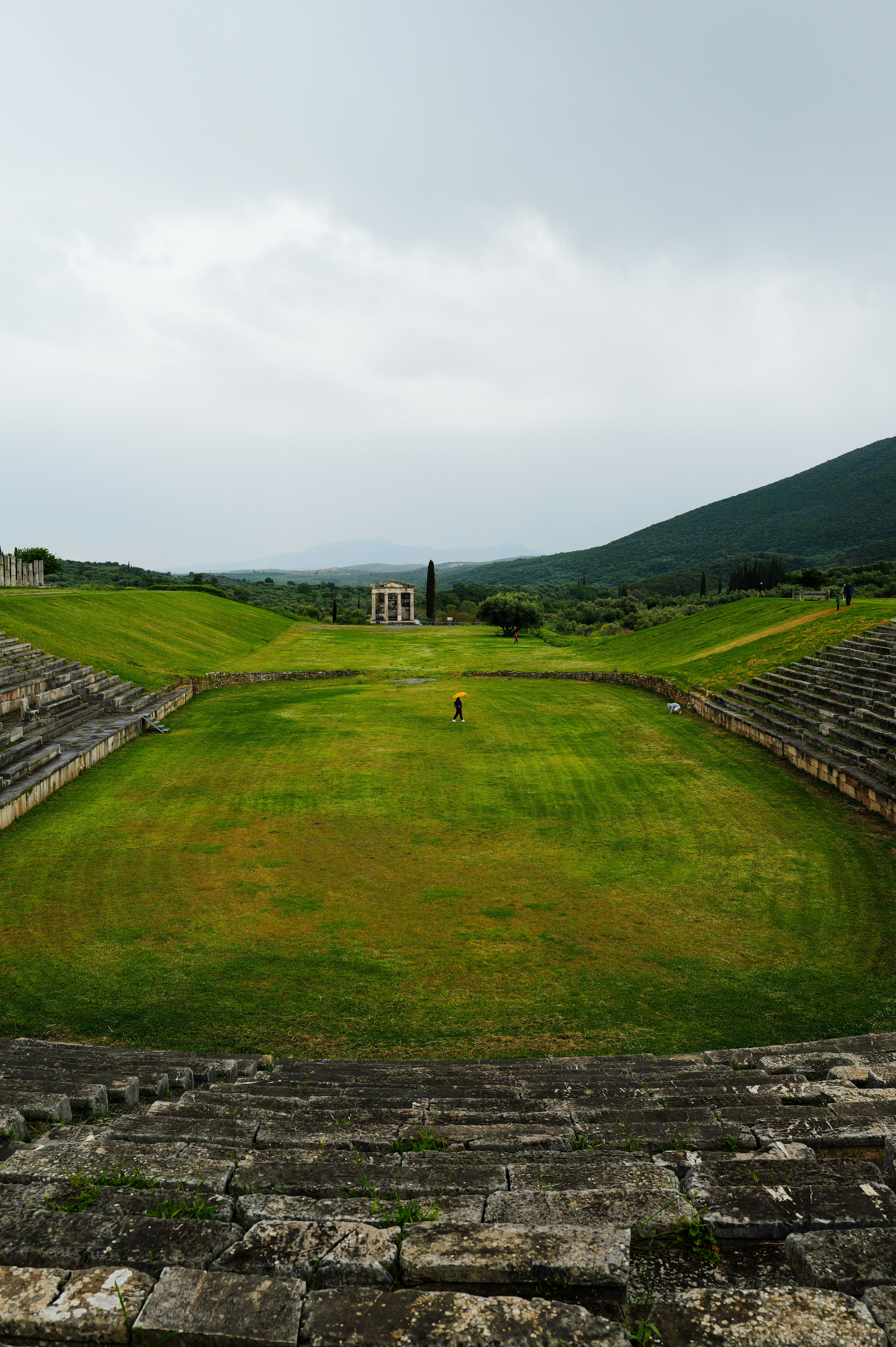 An ancient greek stadium with a beautiful green field. photo – Free ...