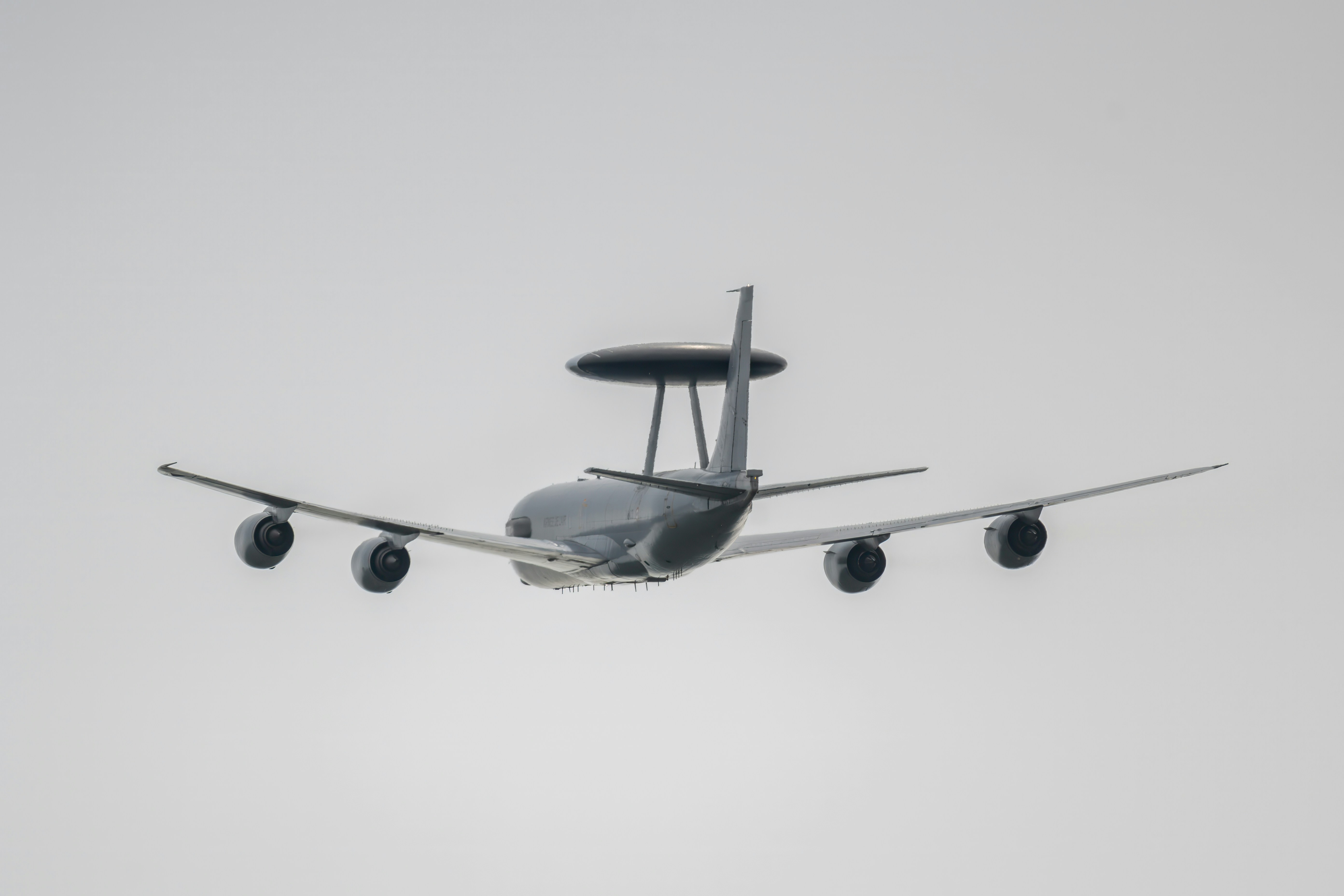 Awacs aircraft flying through a cloudy sky. photo – Free Animal Image ...