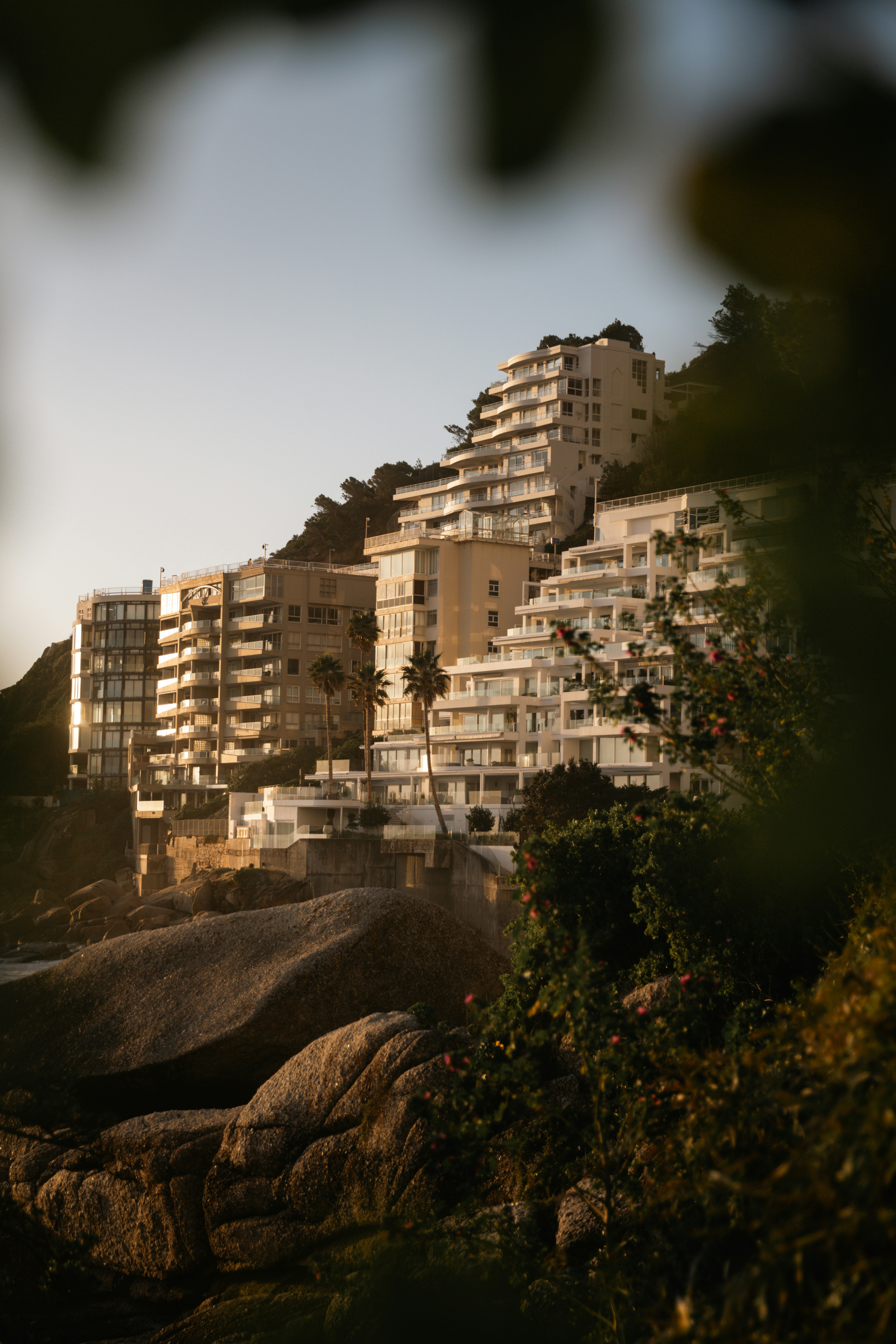 Cliffside Crest: White Modern Homes Turn Toward the Sea at Golden Hour