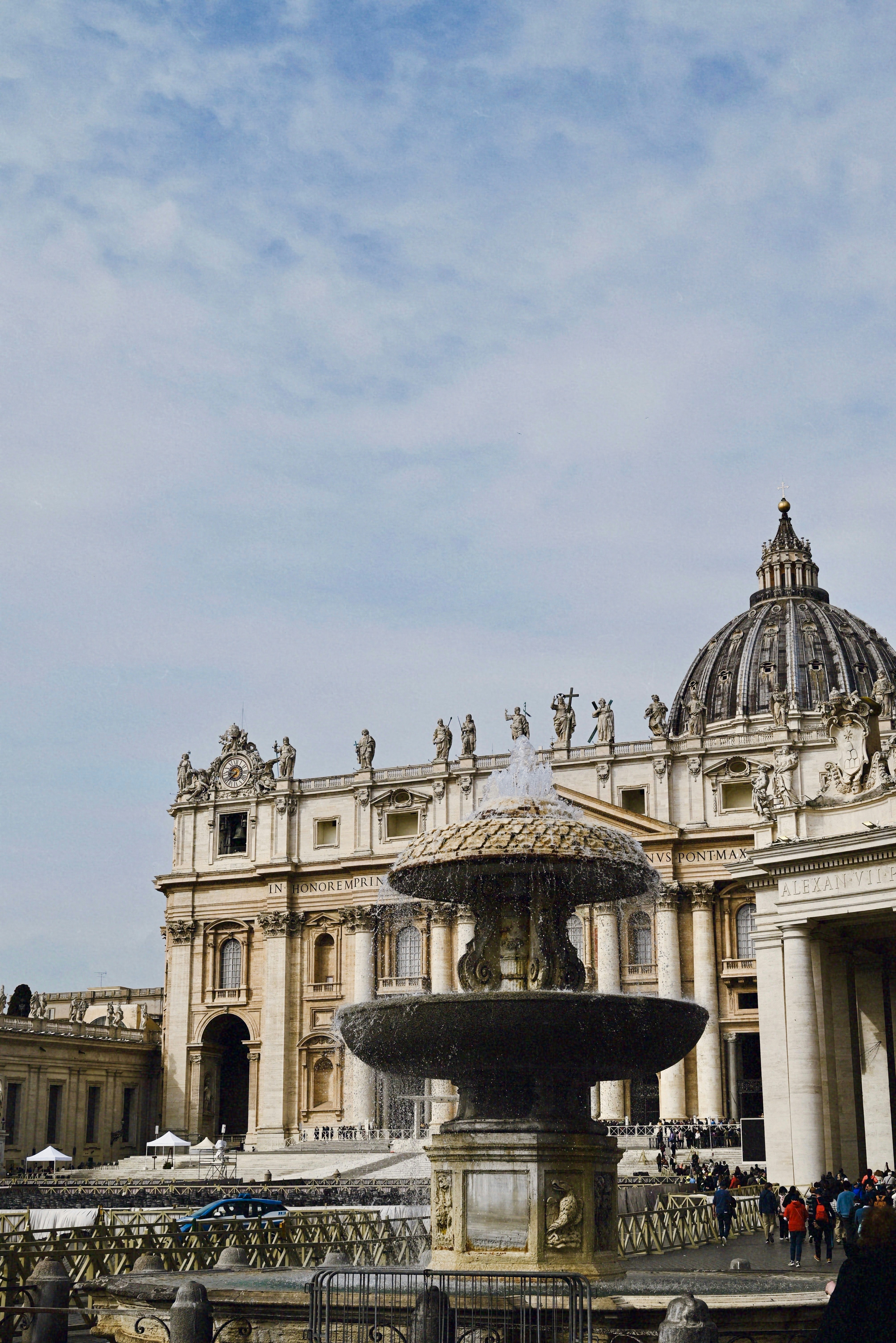 A fountain and st. peter's basilica stand majestically. photo – Free ...