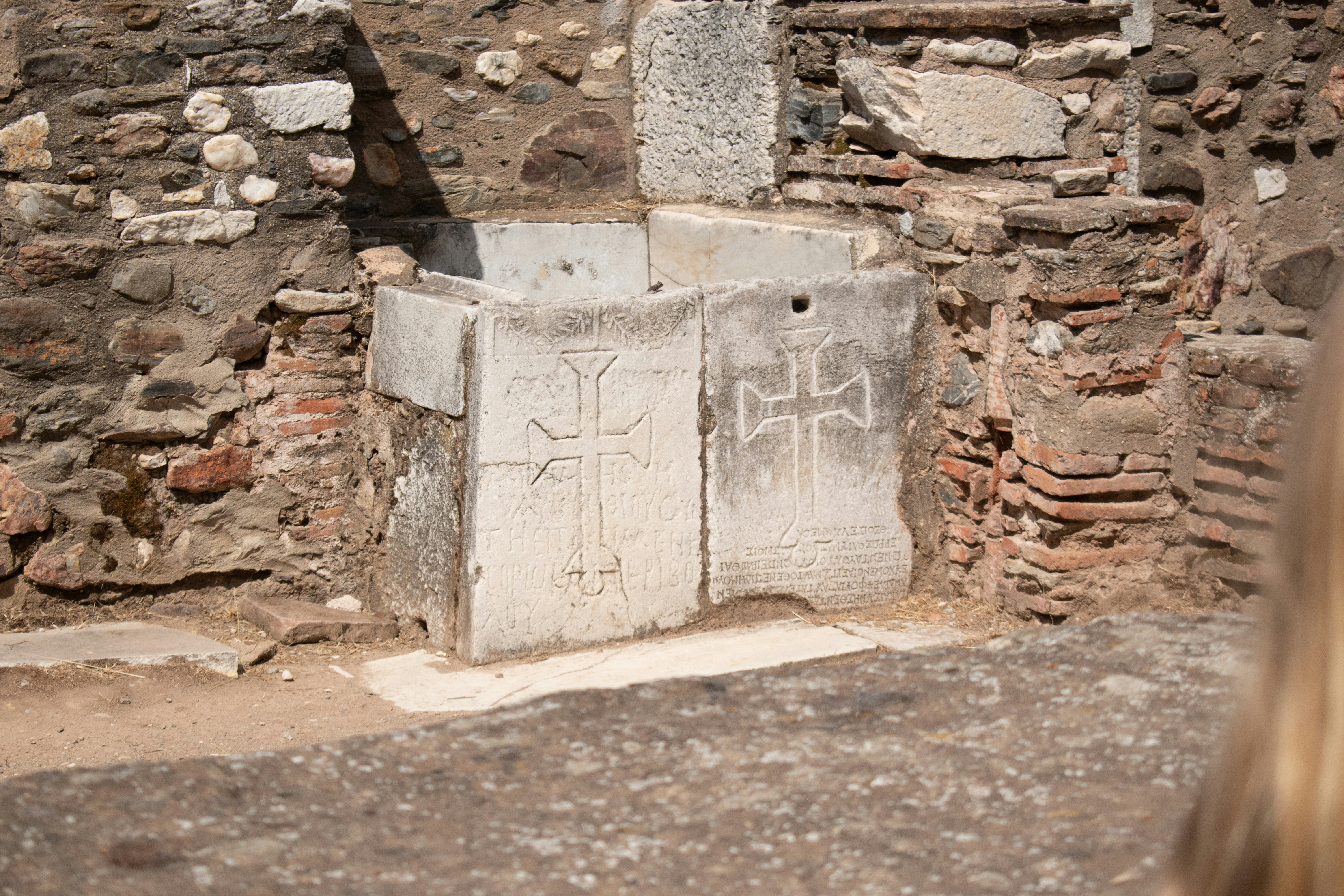An ancient stone structure has crosses carved on it. photo – Free ...