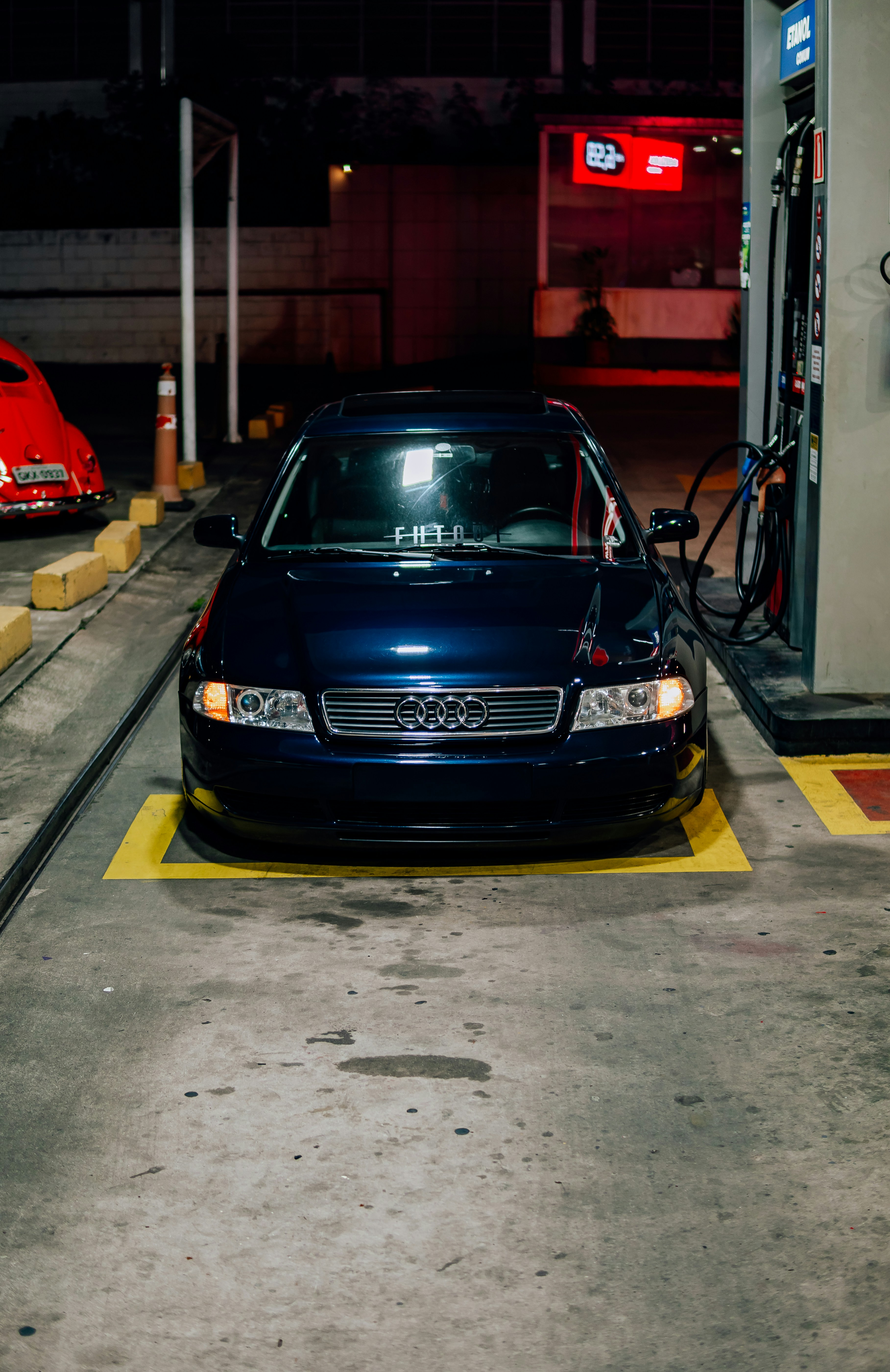 A dark blue audi at a gas station. photo – Free Car Image on Unsplash