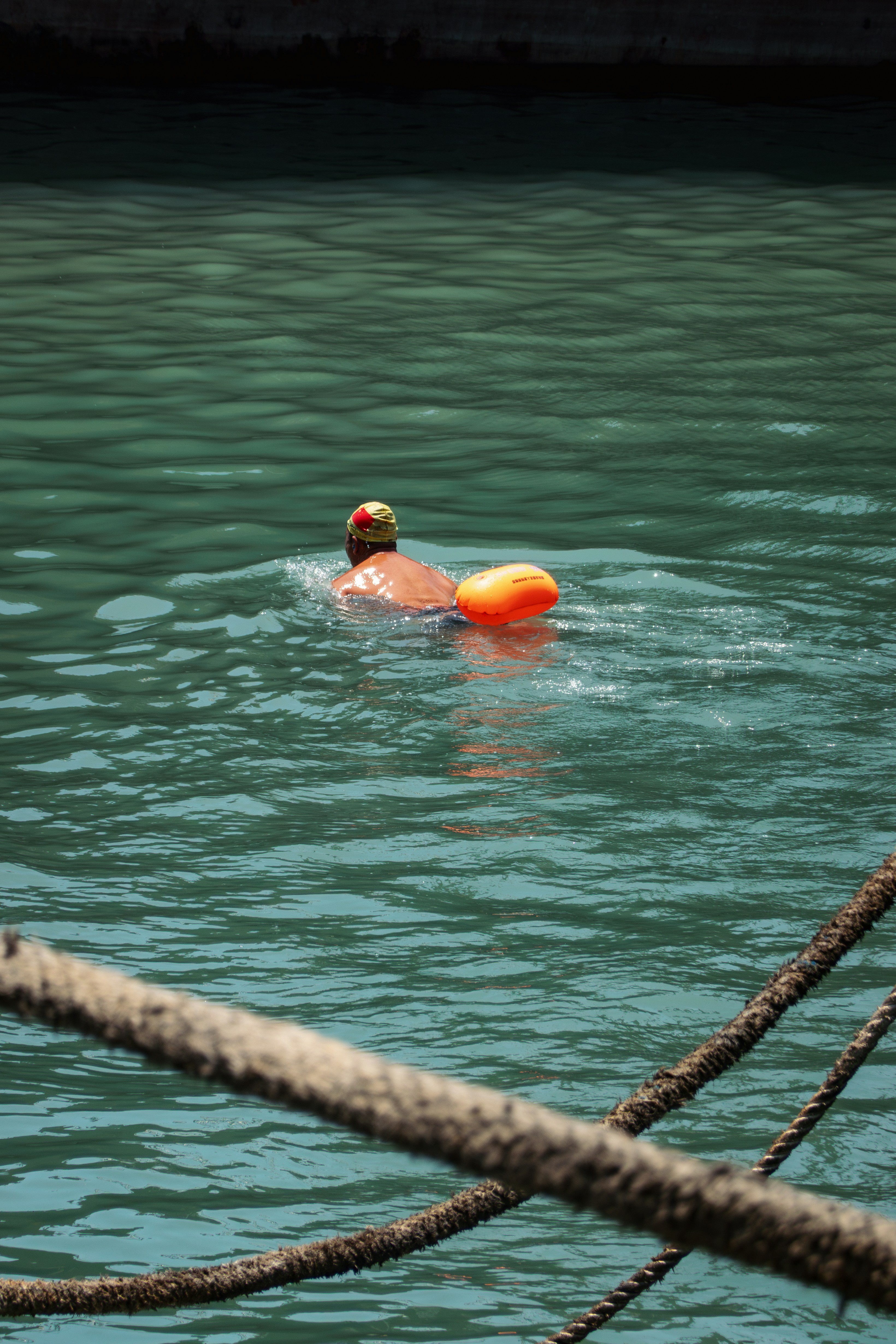 A Swimmer's Solitude in Turquoise Waters