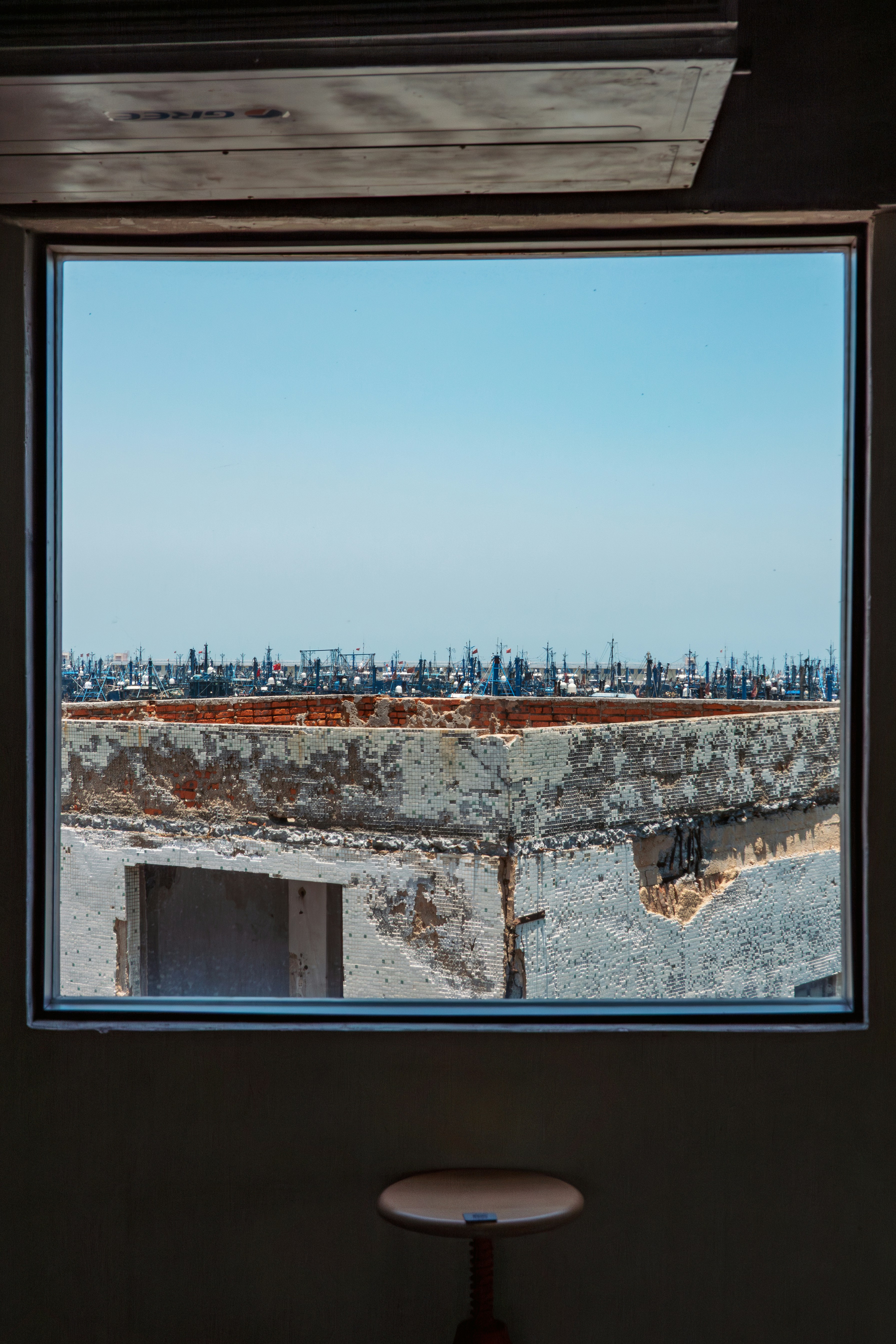 View of a city through a window on a sunny day. photo – Free Quanzhou ...