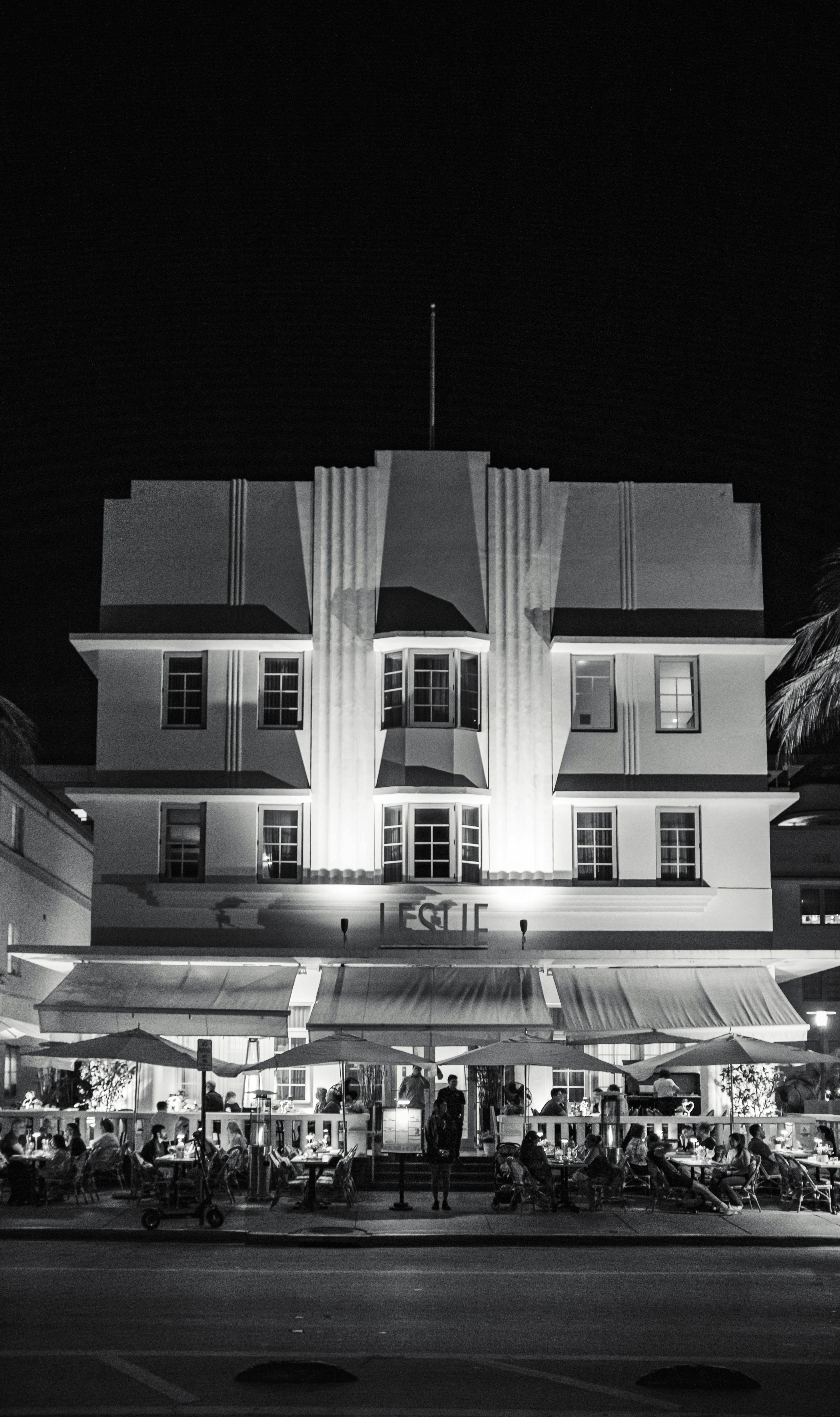 A nighttime view of a lit-up restaurant. photo – Free Building Image on ...