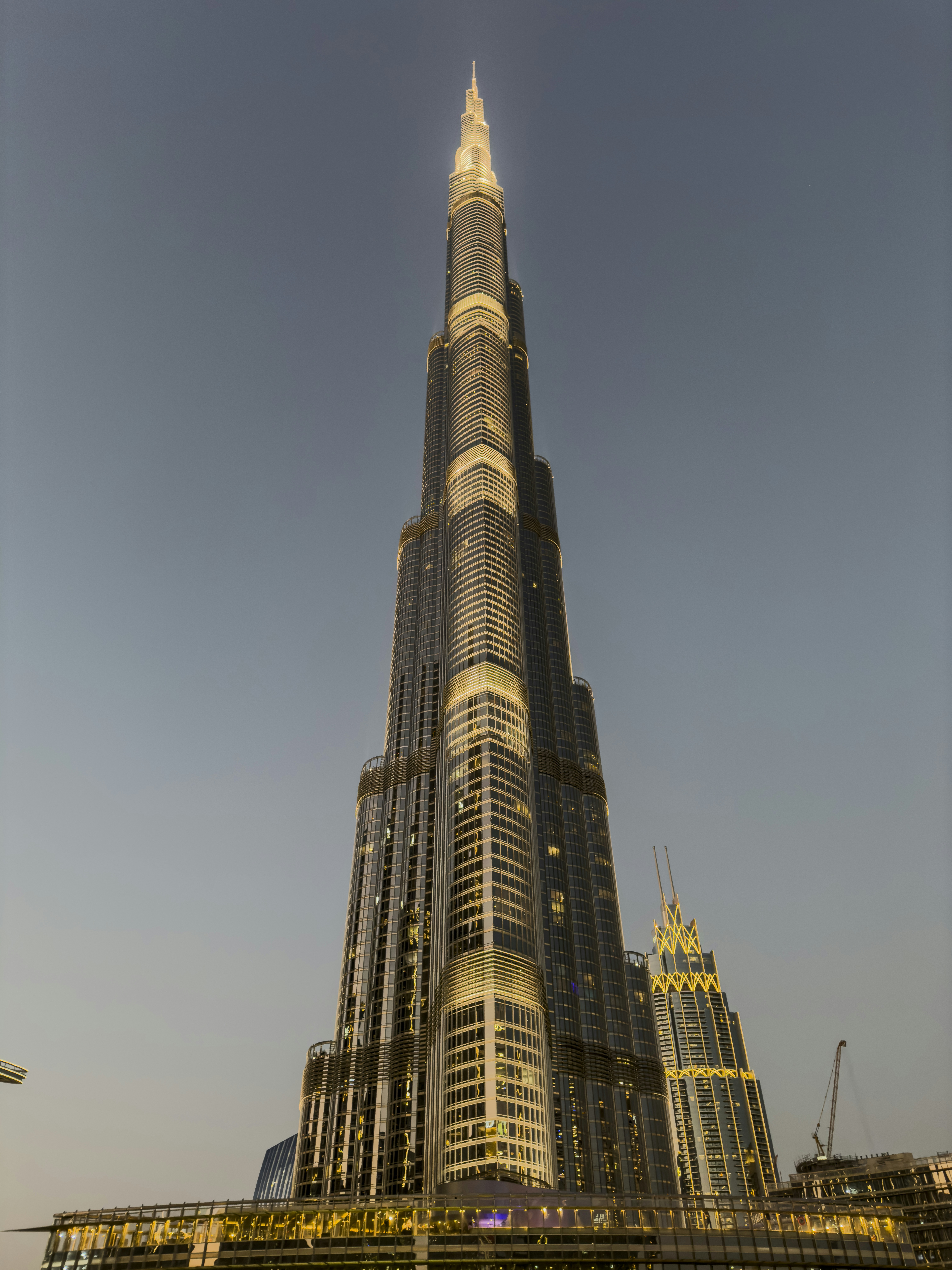 Burj Khalifa towering against a twilight sky, showcasing its sleek design and illuminated façade.