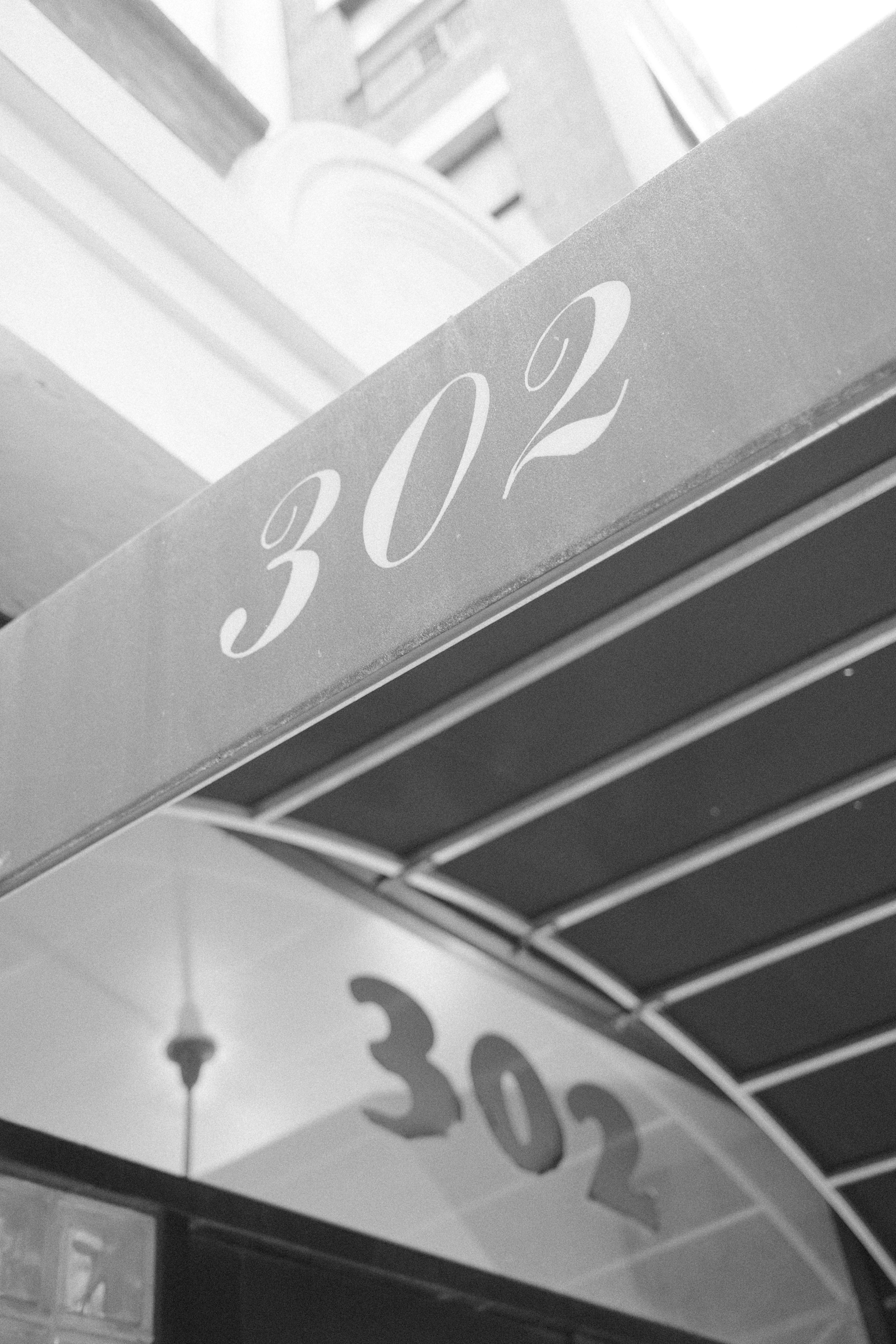 The number 302 is displayed on a building. photo – Free Urban Image on ...