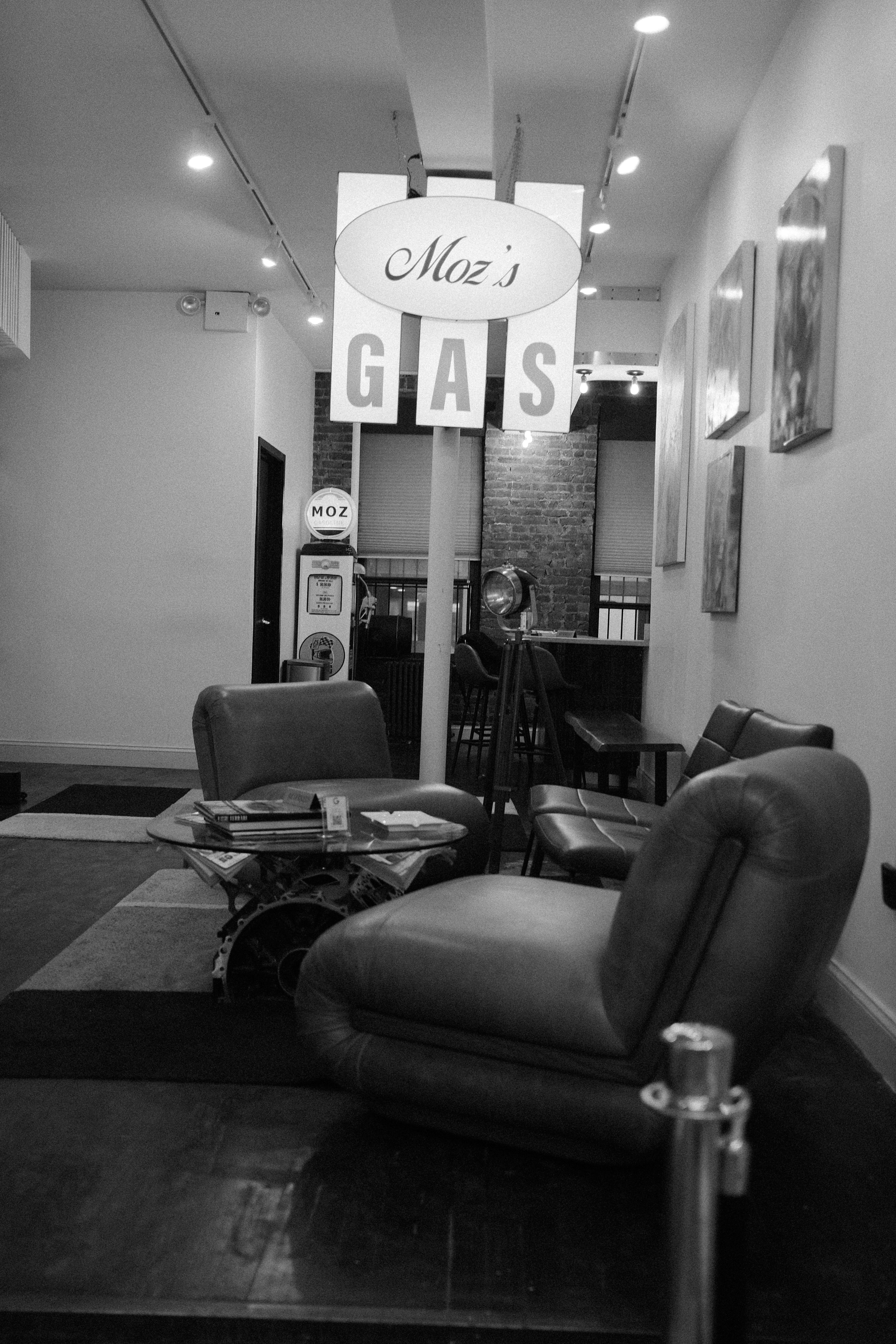 Moz’s Gas Sign and Velvet Lounge: A Quiet Monochrome Café Moment