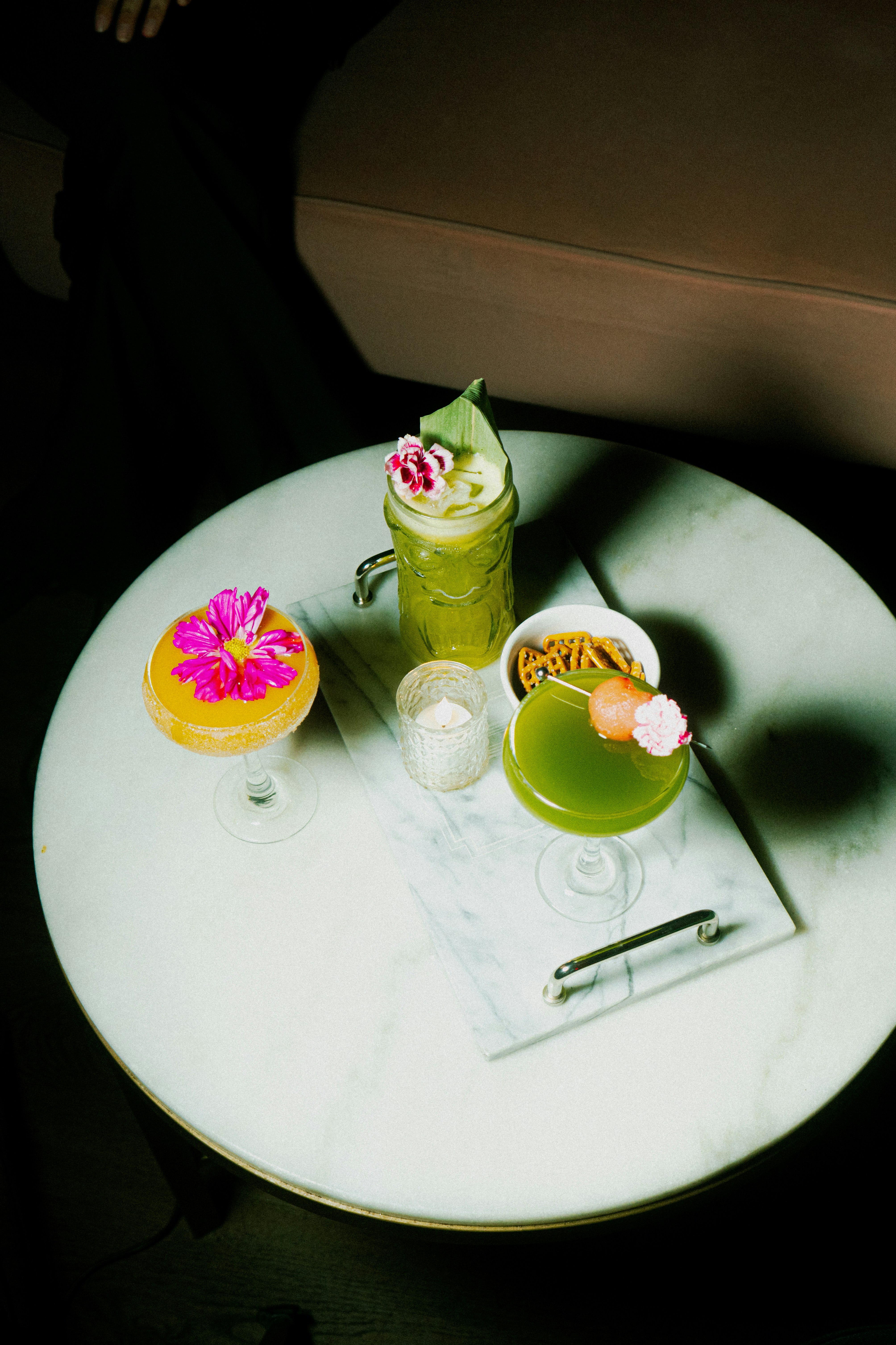 Emerald Elixirs on Marble: A Quiet Night at the Table