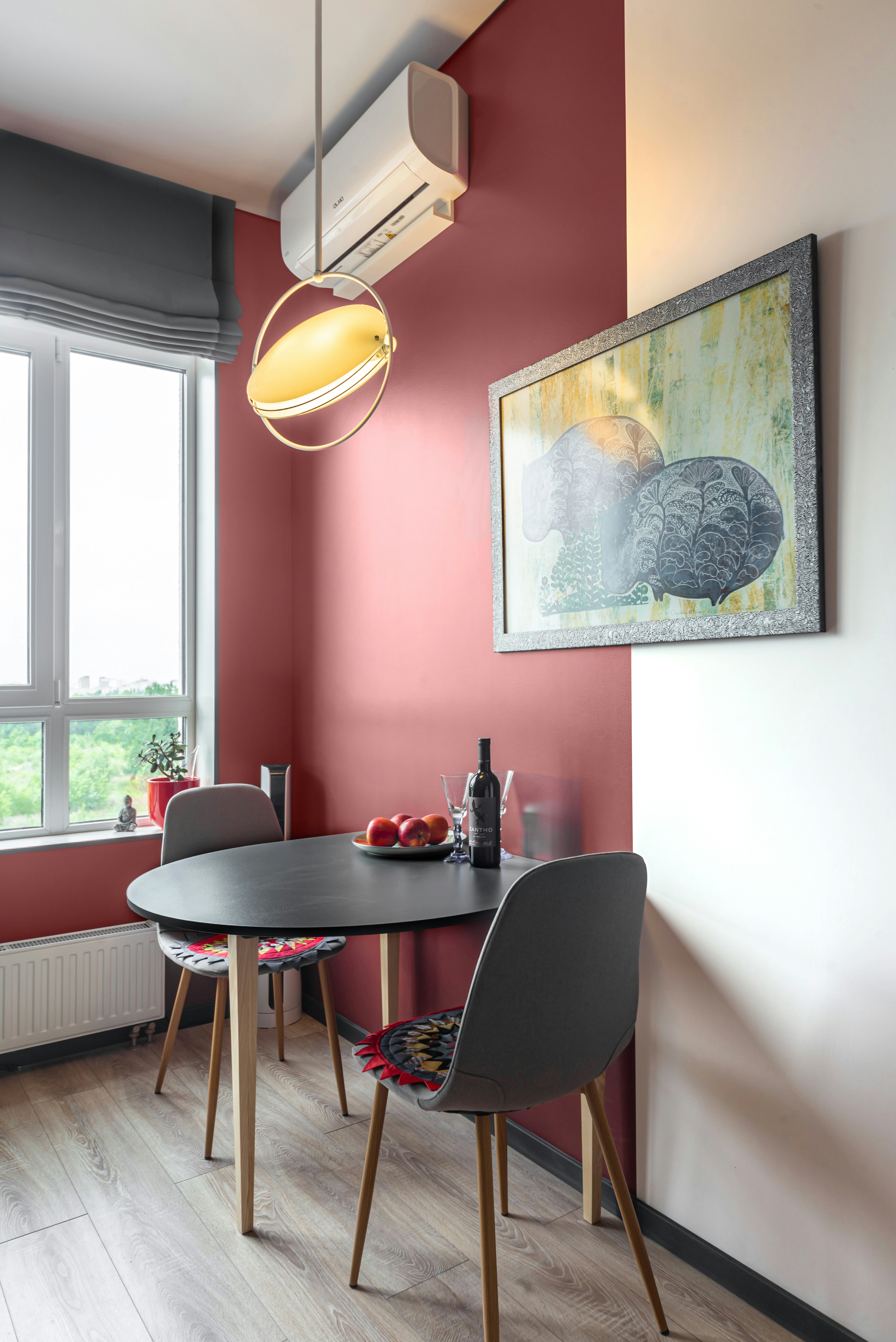 Cozy Dining Nook with Rich Burgundy Accent Wall