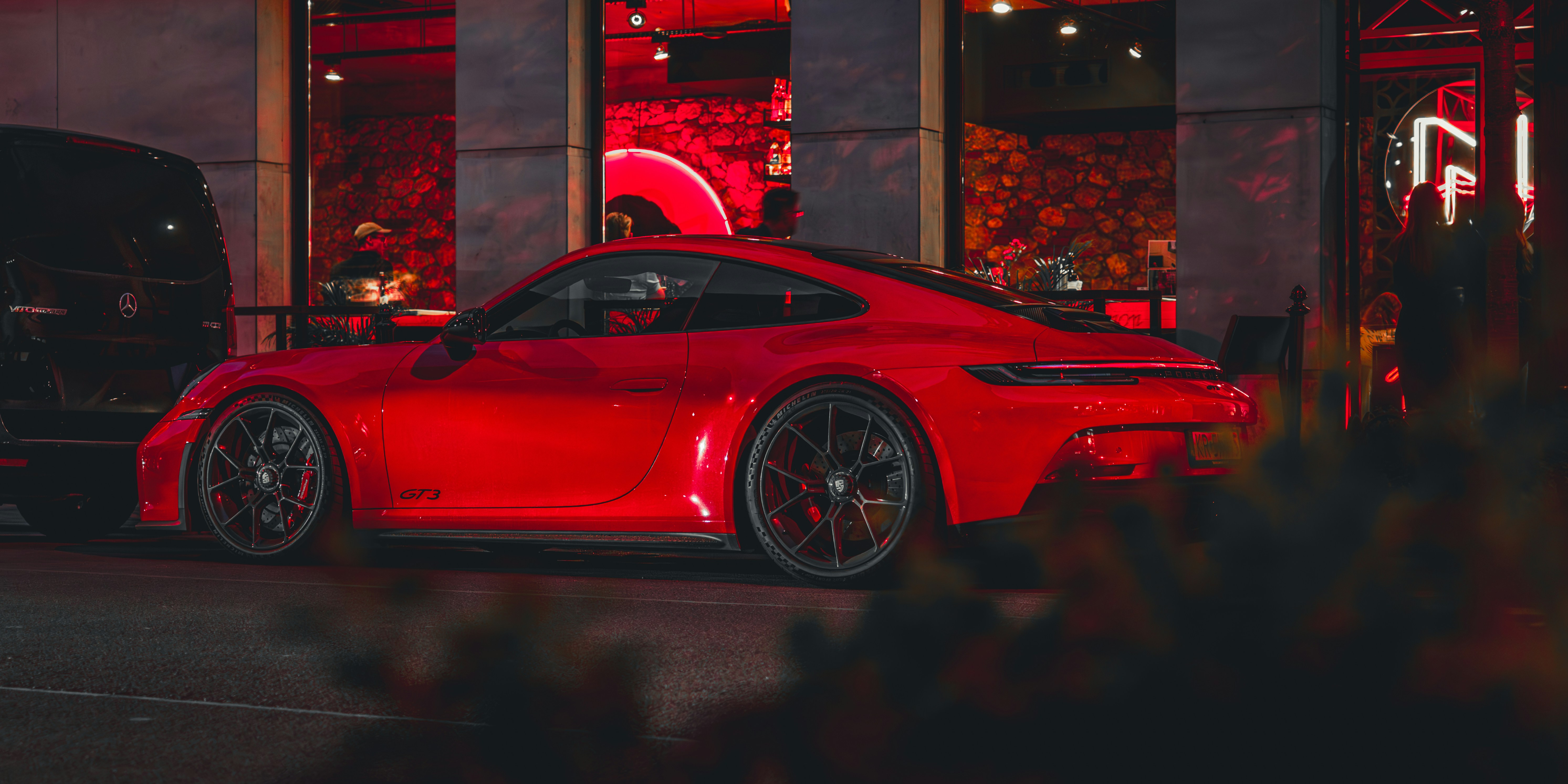 Crimson Porsche in Neon Night: Precision Lines under Urban Glow