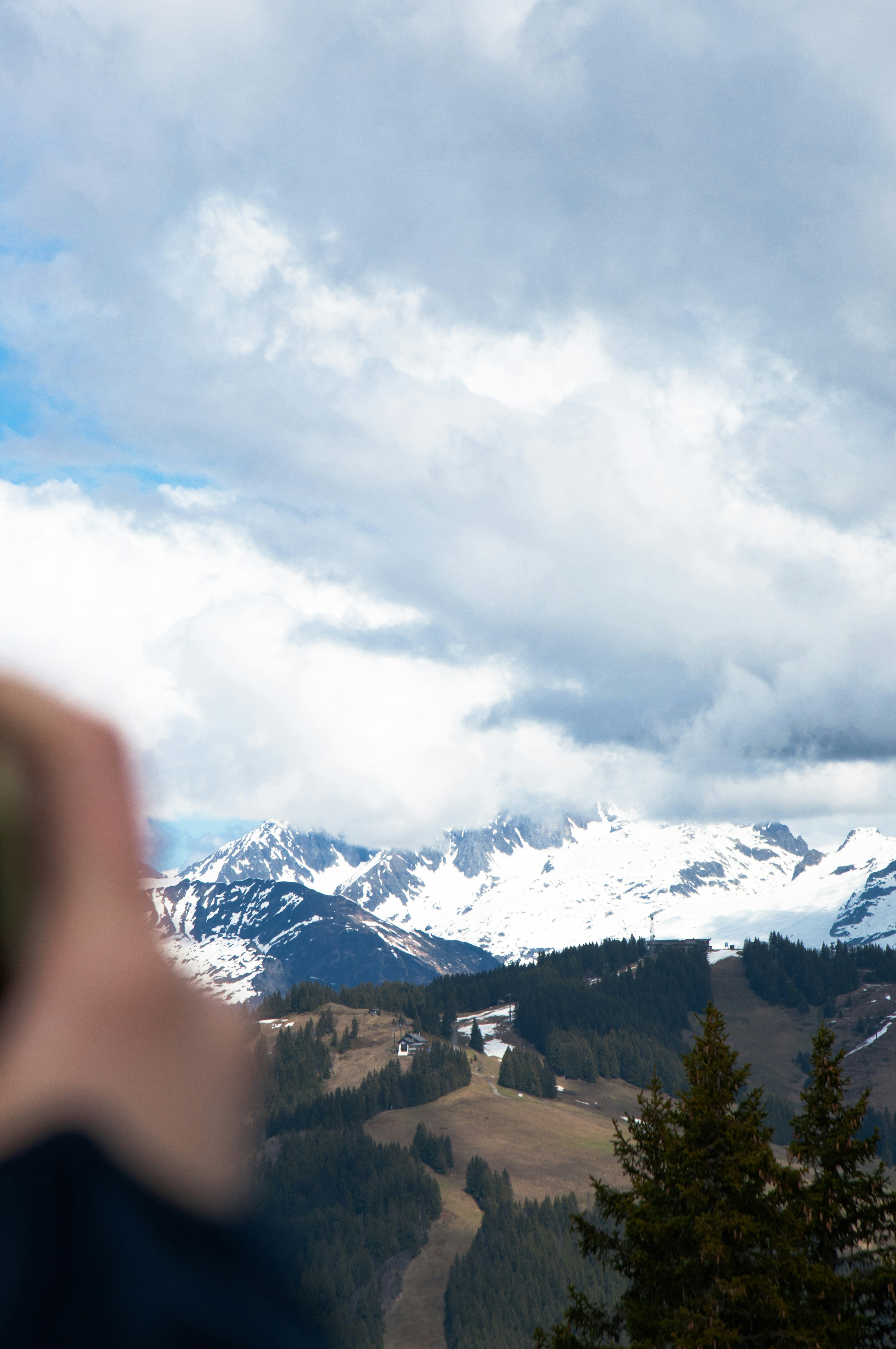 Snowbound Ridge Beneath a Sky of Moving Clouds