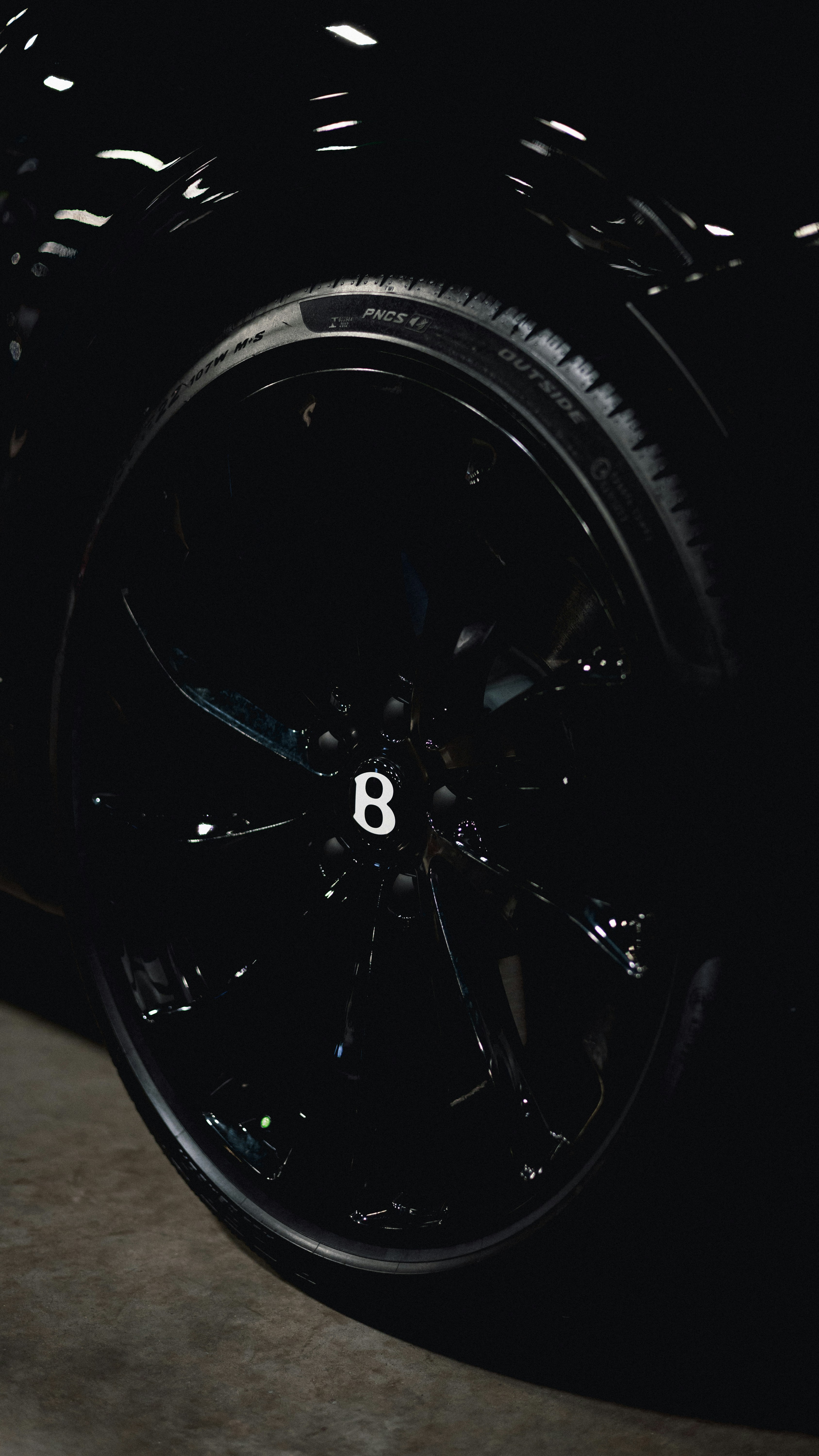 A black bentley wheel. photo – Free Image on Unsplash
