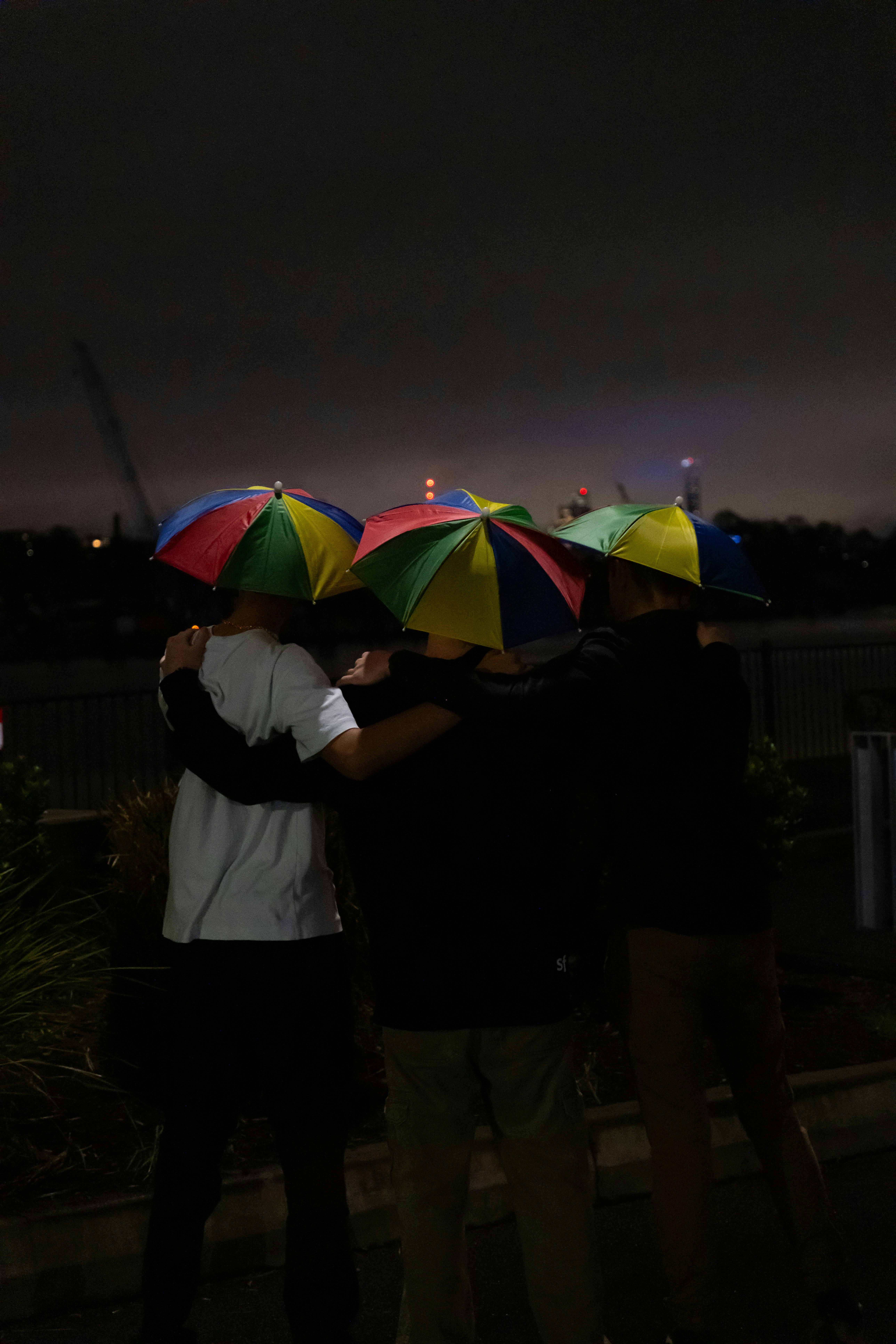 Umbrella Unity Under the Night Sky