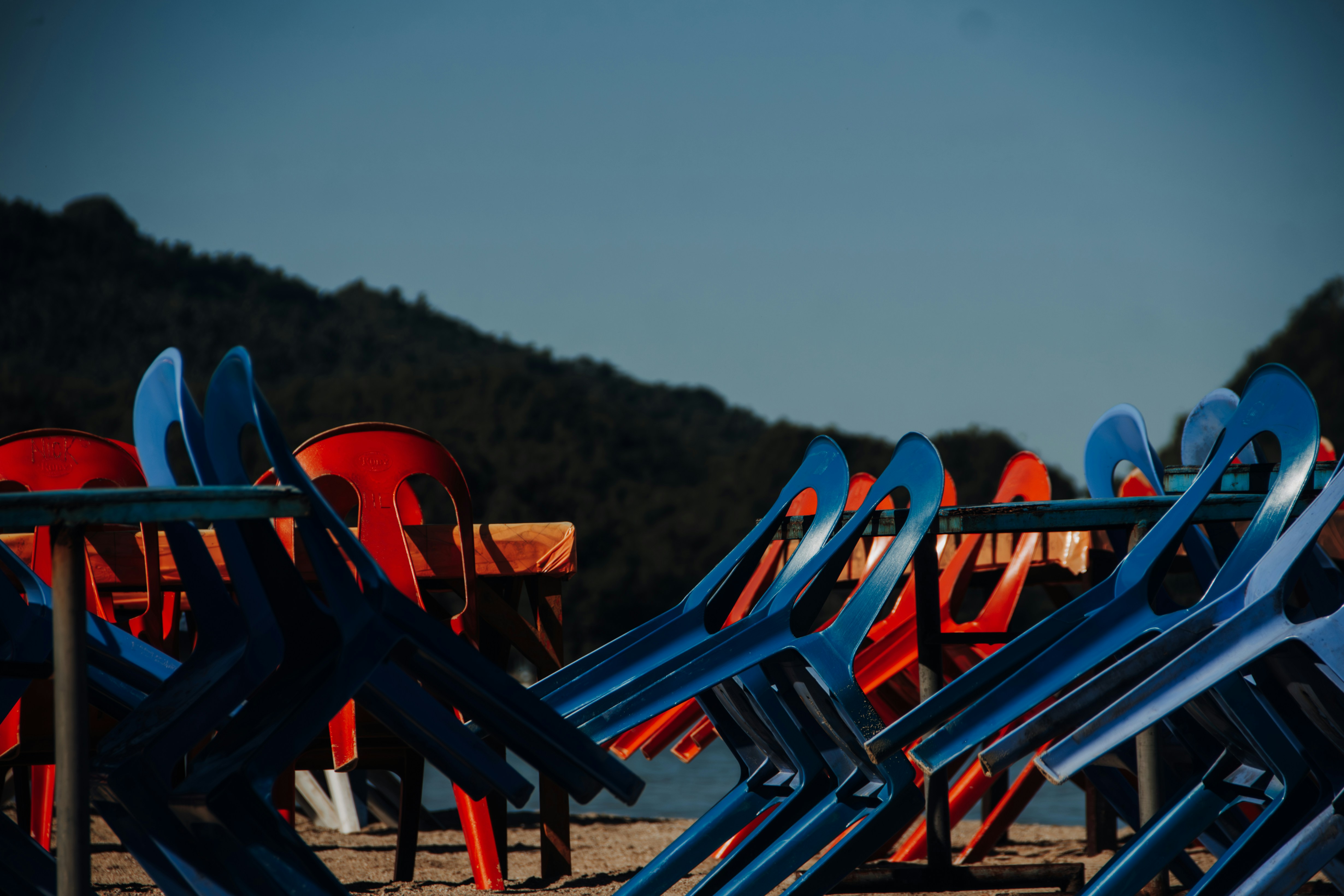 Choreography of Plastic Seats on a Sandy Stage
