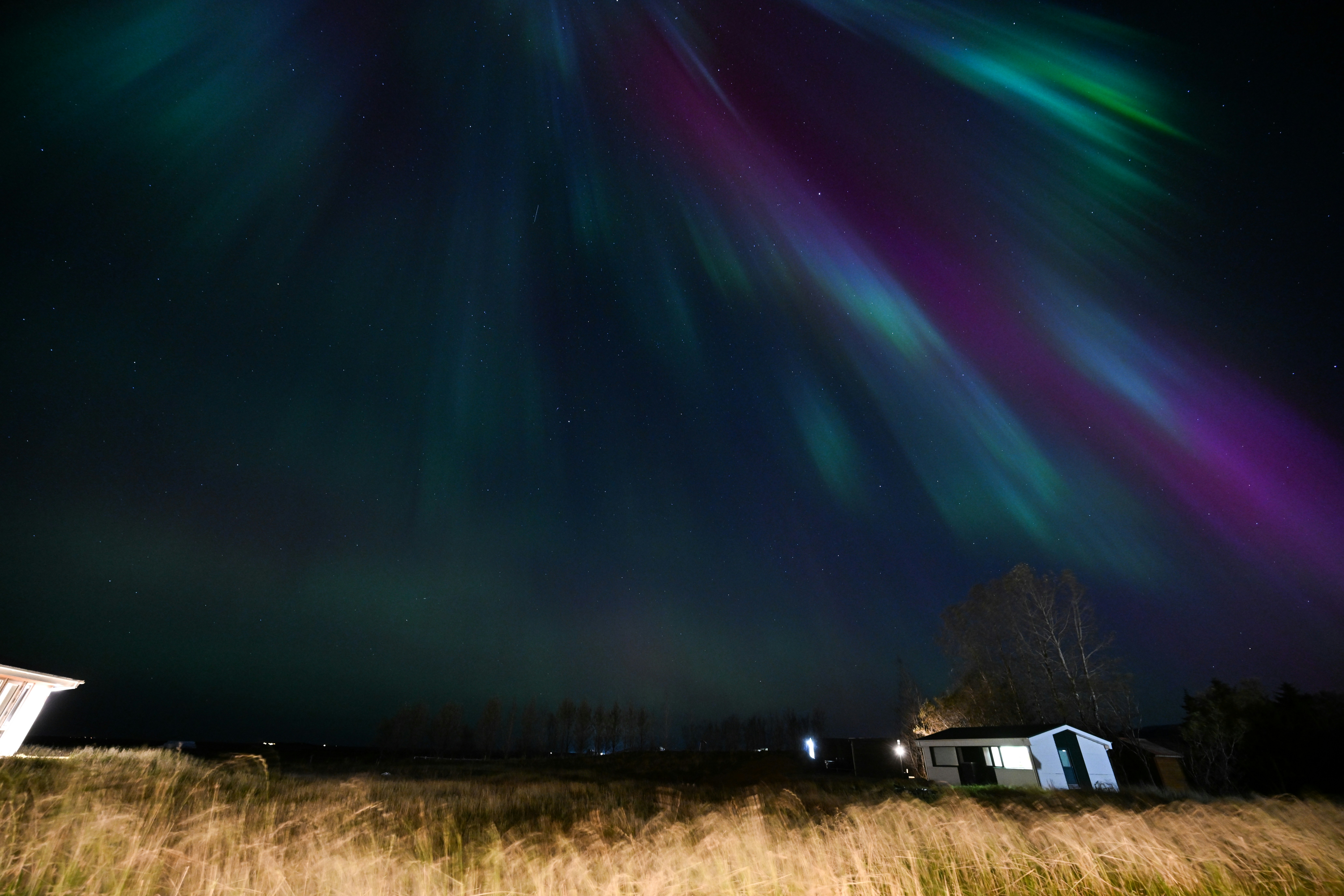 Celestial Dance Over Tranquil Fields