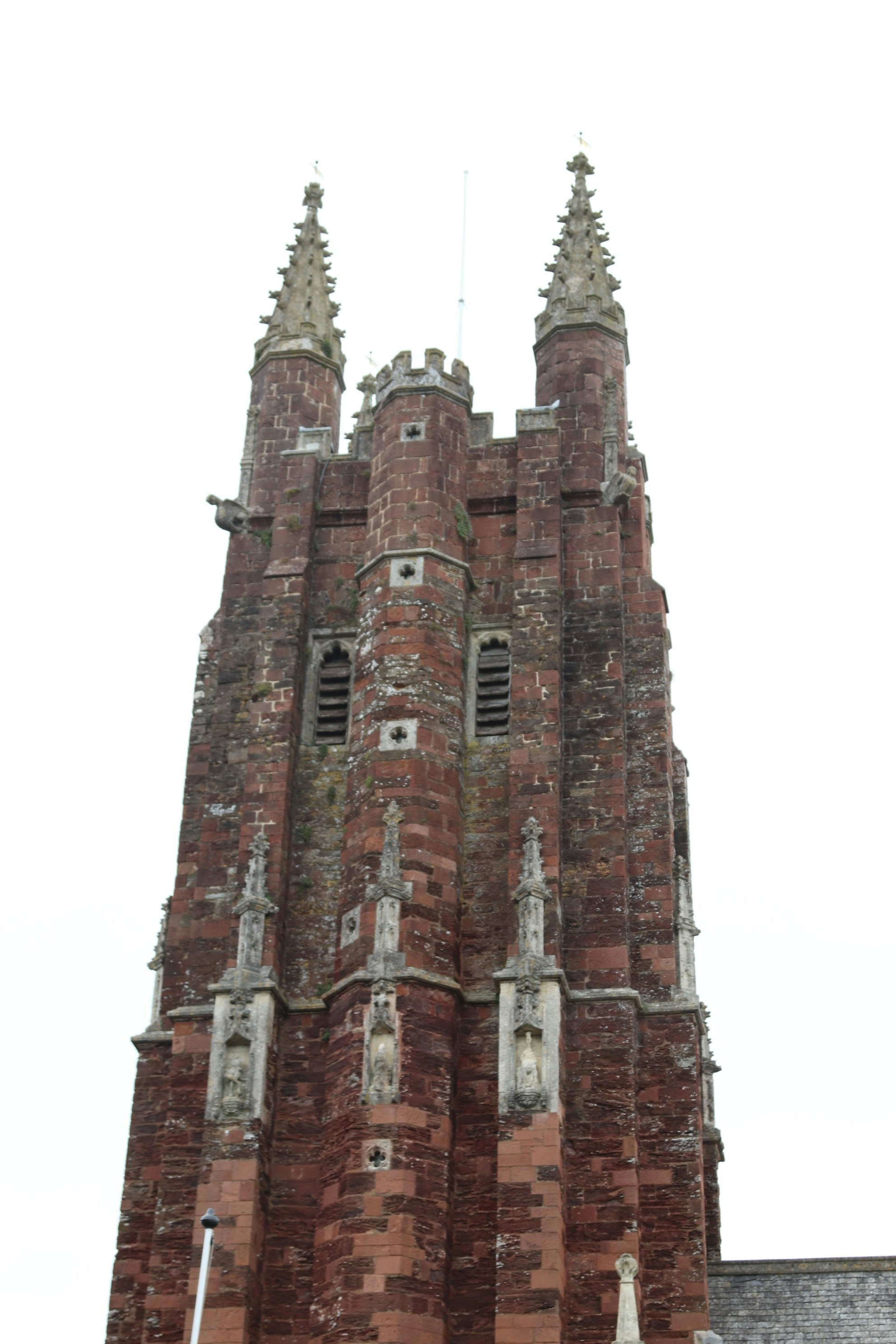 Crimson Spires: A Gothic Bell Tower Reaching Toward the Sky
