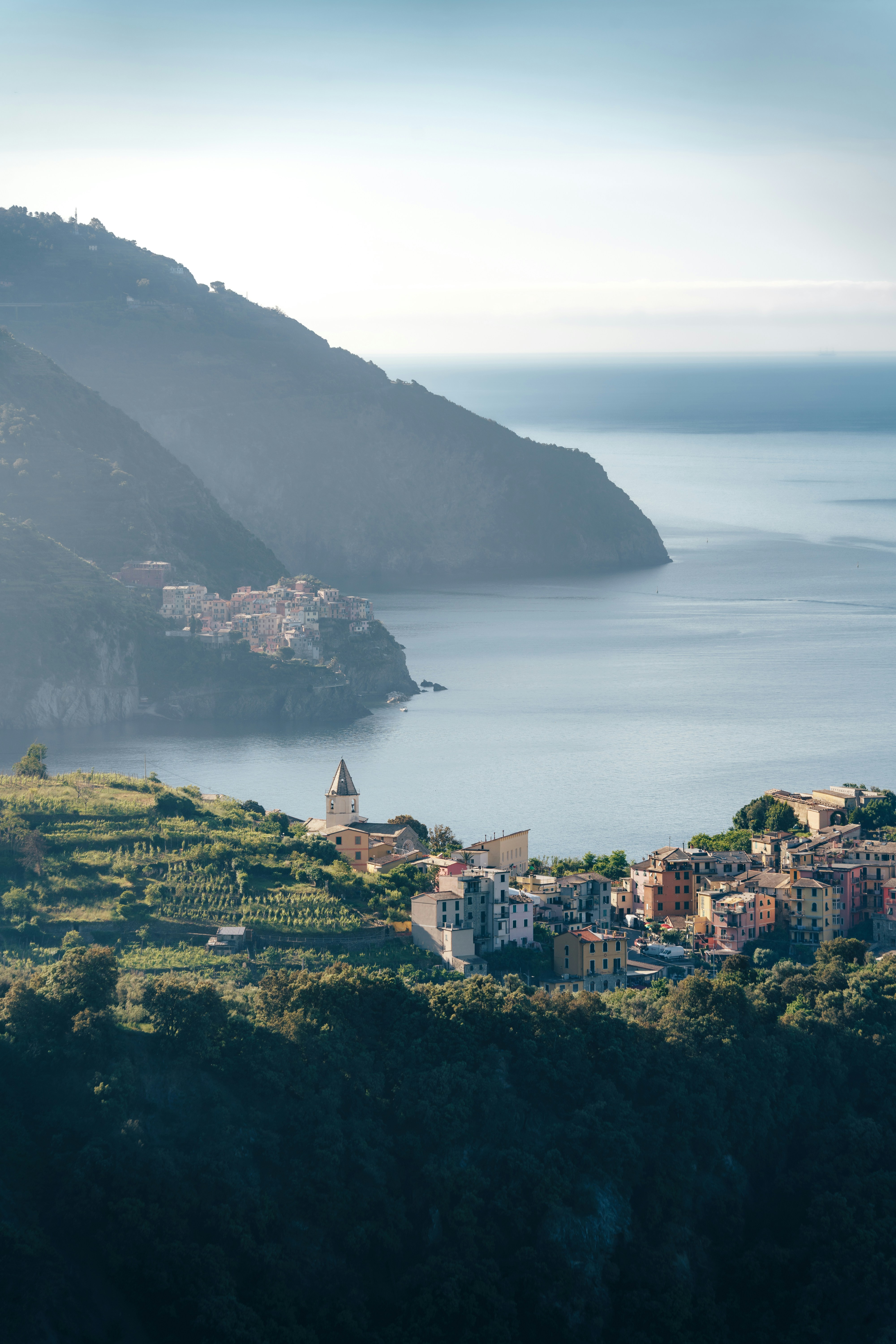 Terraced Coastal Village Embraced by Sea Mist