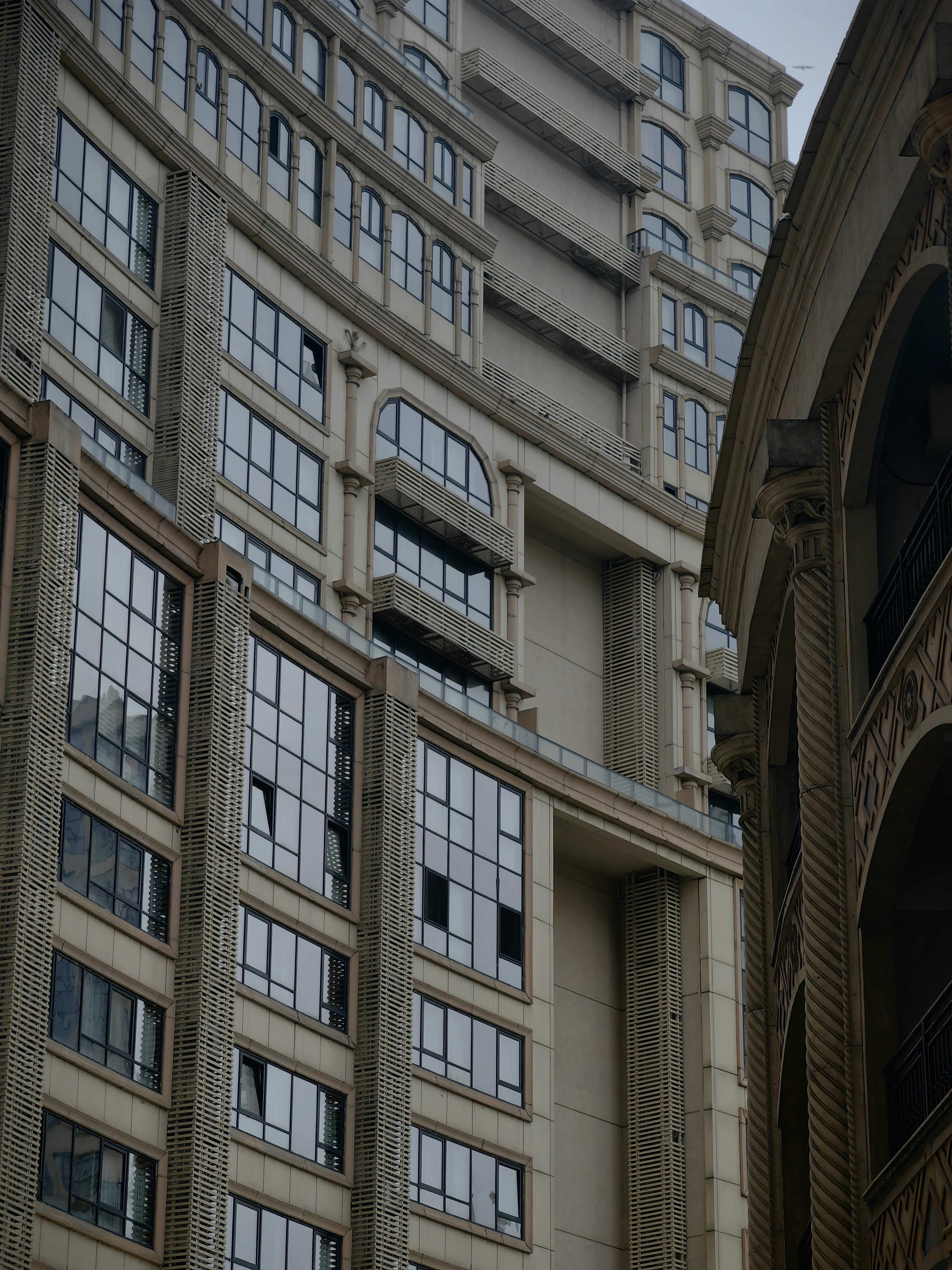 Lattice of Light: Repeating Windows and Arches on a Modern High-Rise