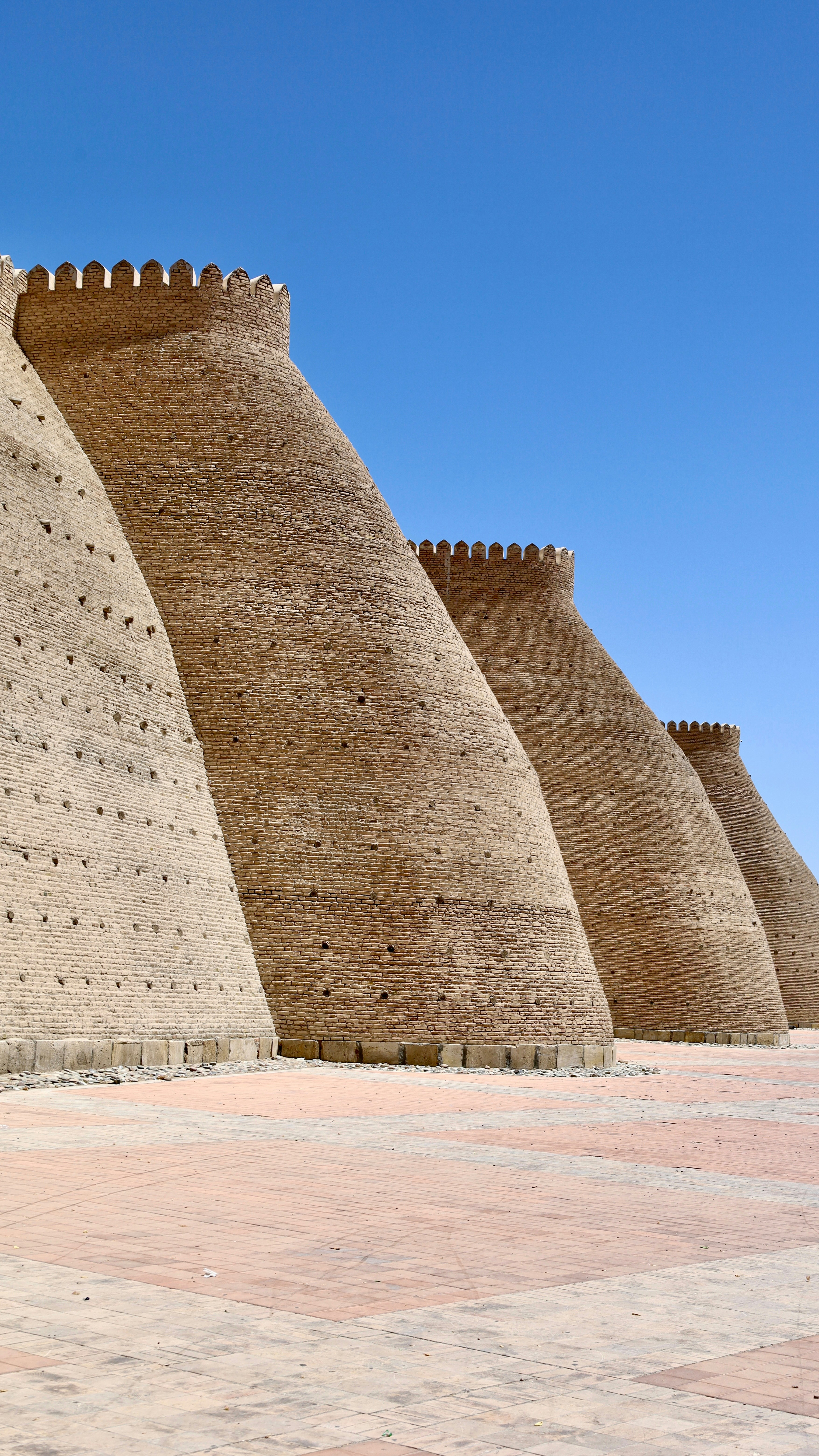 Monumental structures stand proudly under a clear, blue sky.