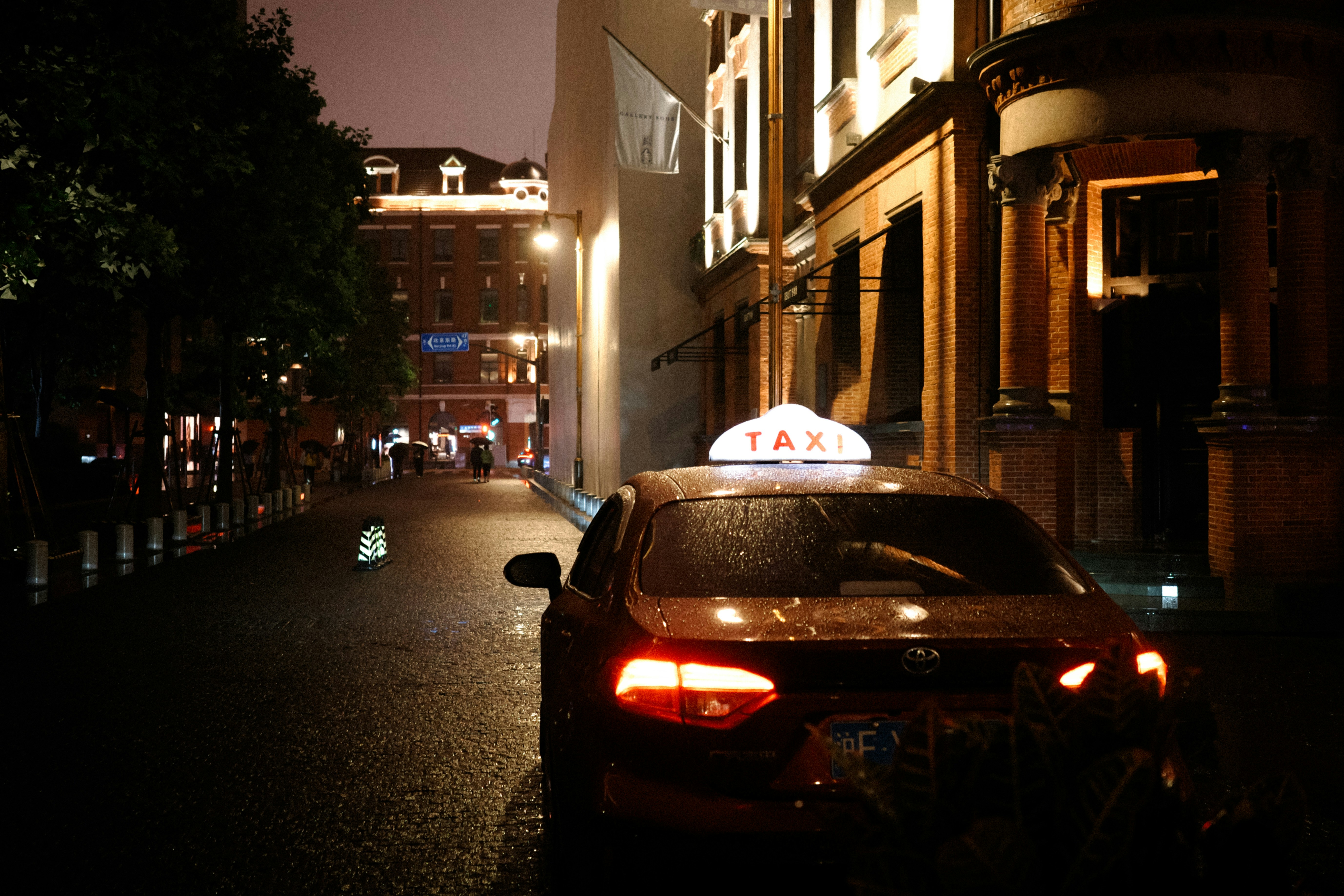 Night Taxi Tour Down a Quiet Cobblestone Street
