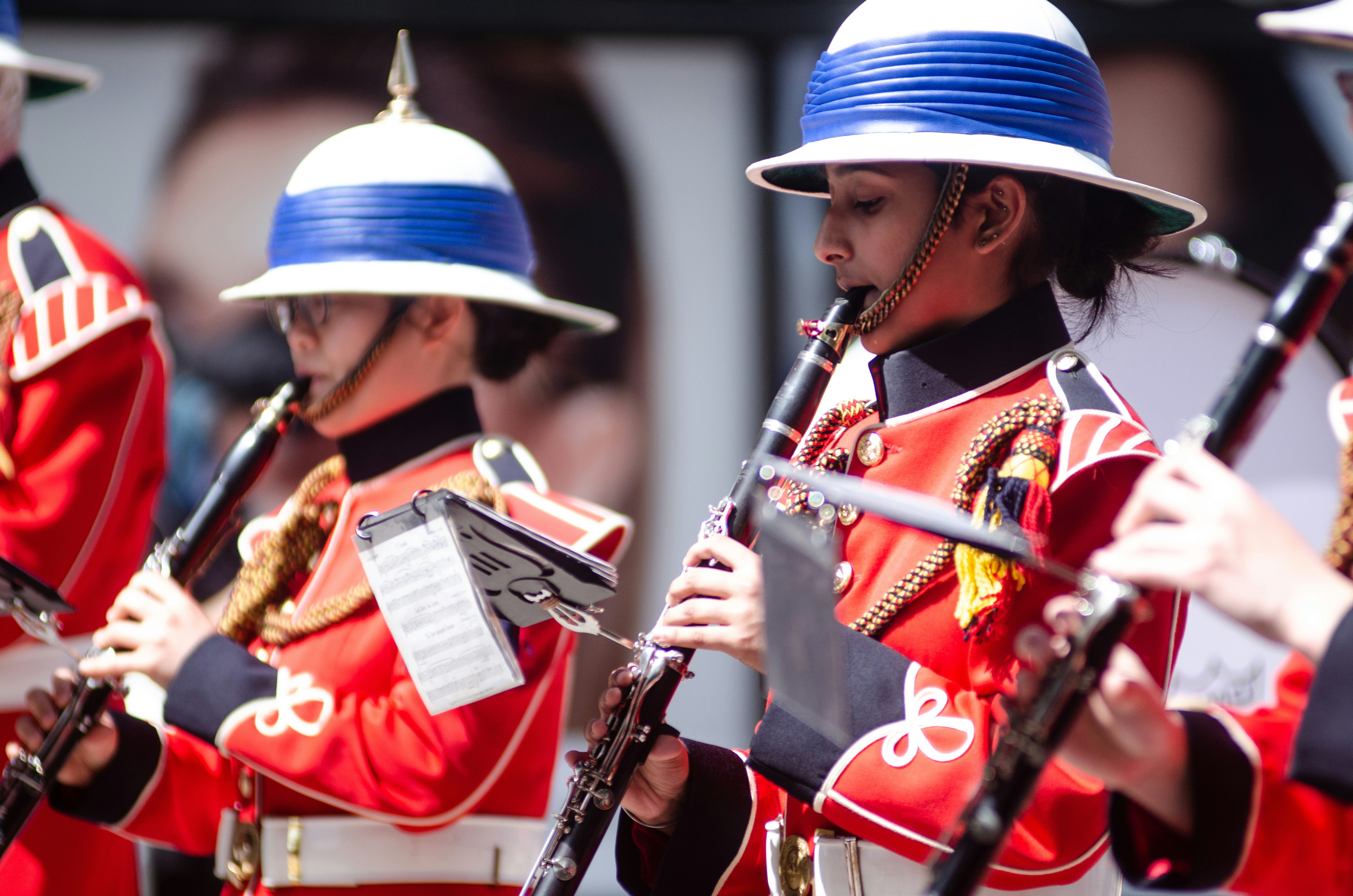 A marching band plays clarinets in red uniforms. photo – Free Marching ...