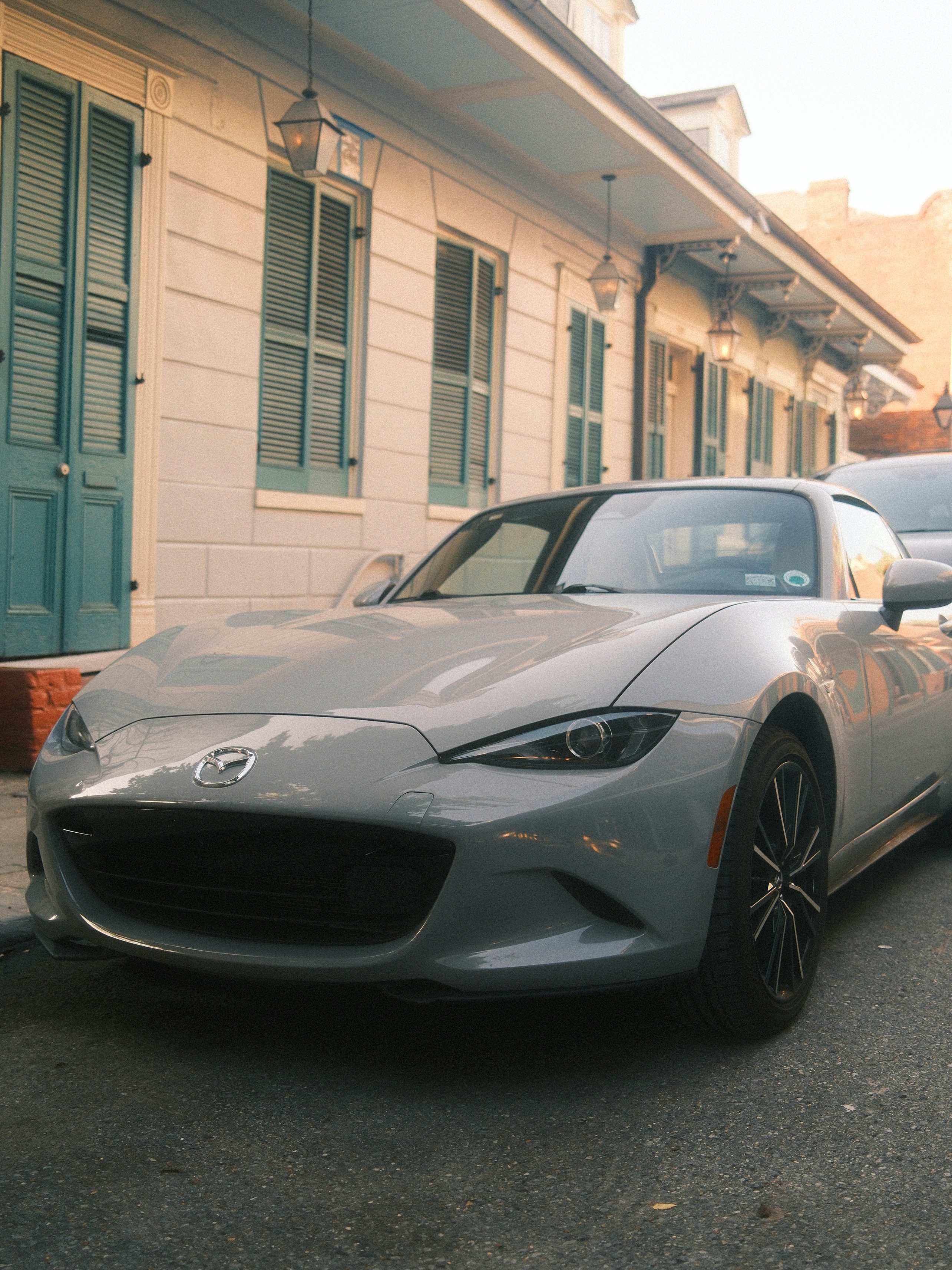 Pastel Facades, Steel Curves: A Mazda MX-5 on a Quiet Street
