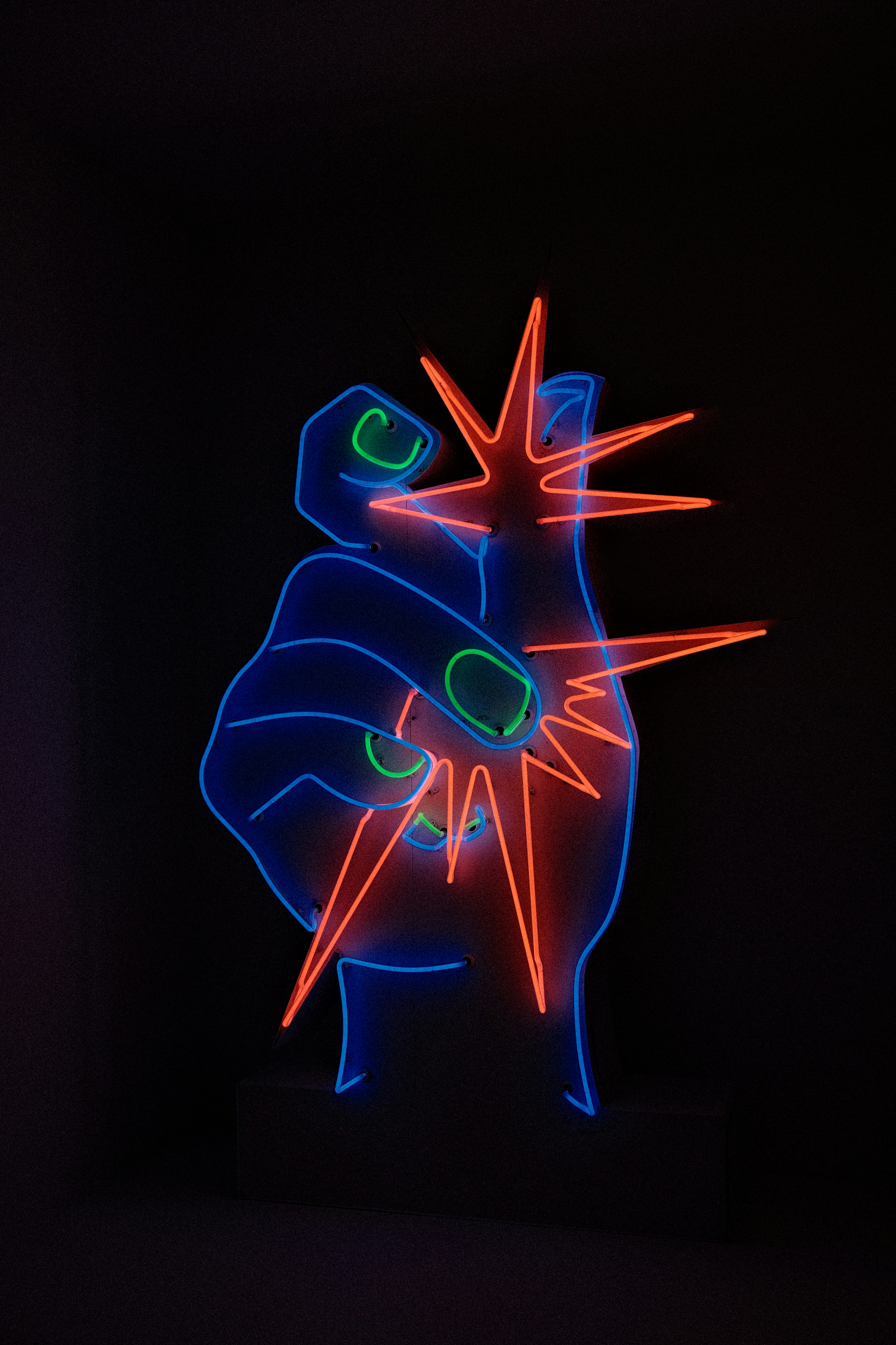 Spiked Neon Hand: Blue Silhouette with Fiery Orange Rays