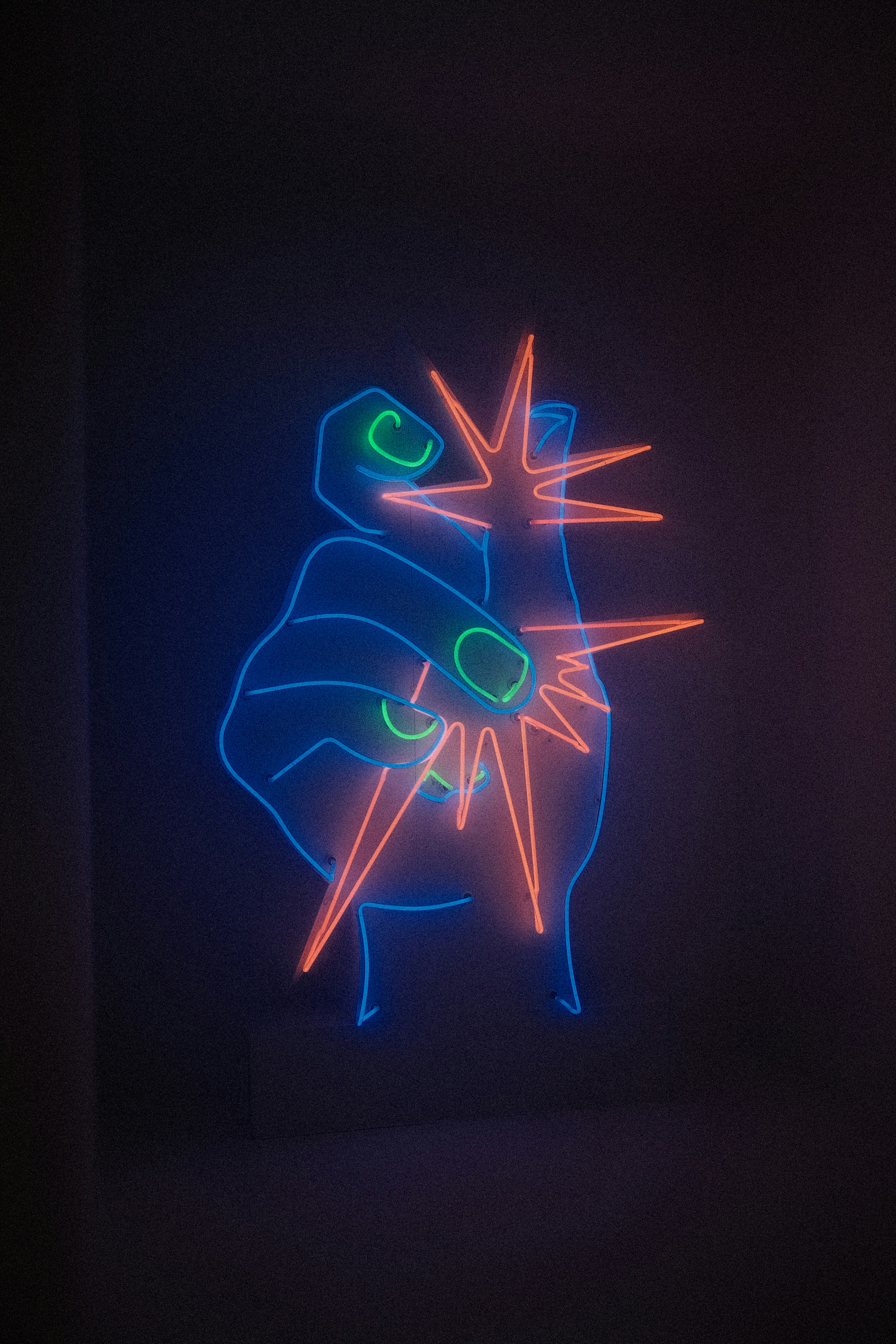 Neon hand with star-like bursts.Valentin Lacoste